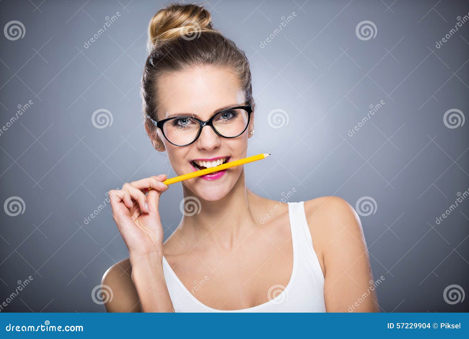 Woman biting a pencil stock photo. Image of people, adult - 57229904