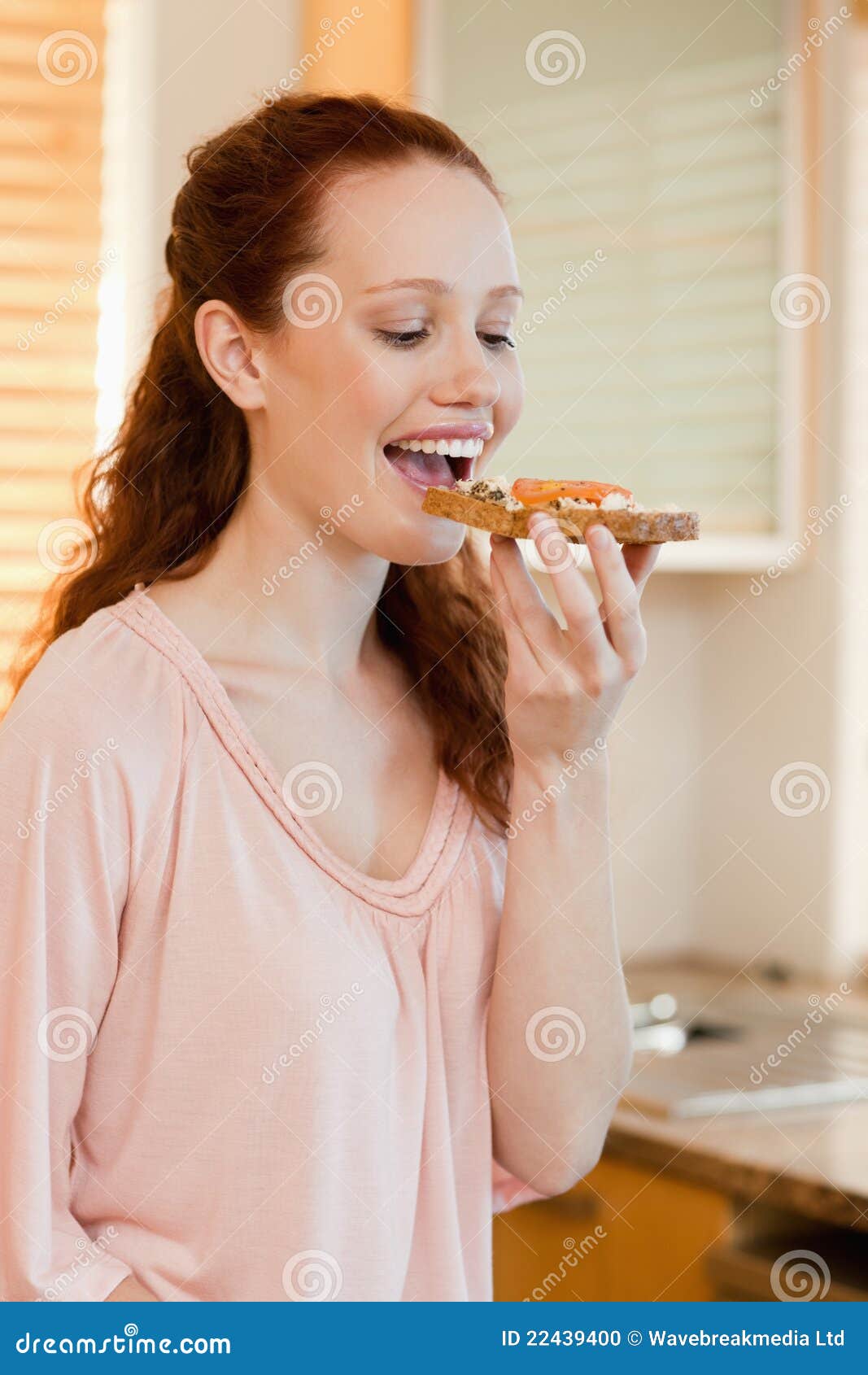 Woman Biting into Slice of Bread Stock Photo - Image of sandwich, home ...