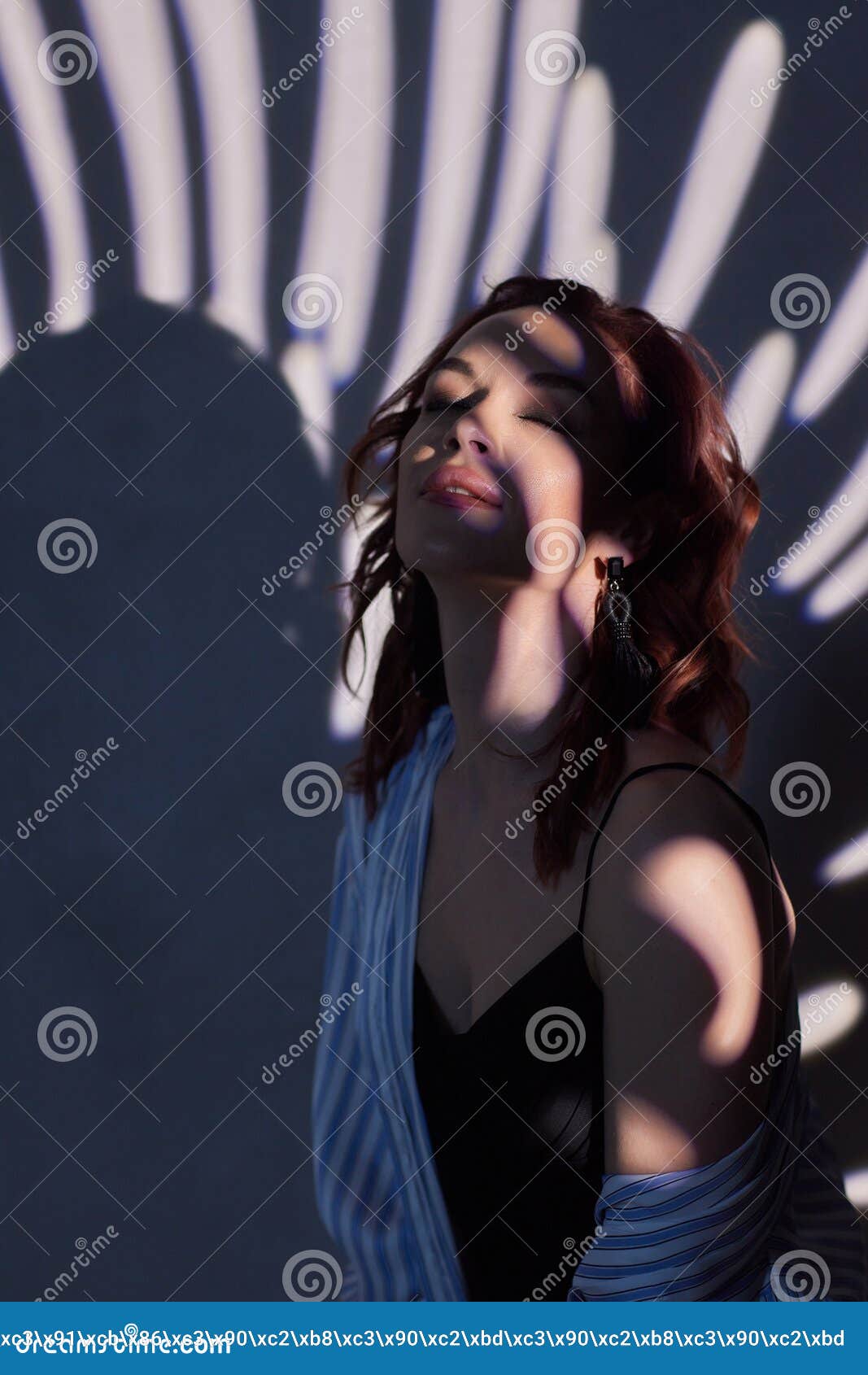 Woman in Black Bodysuit in the Backlight of a Photo Studio. Stock Image ...