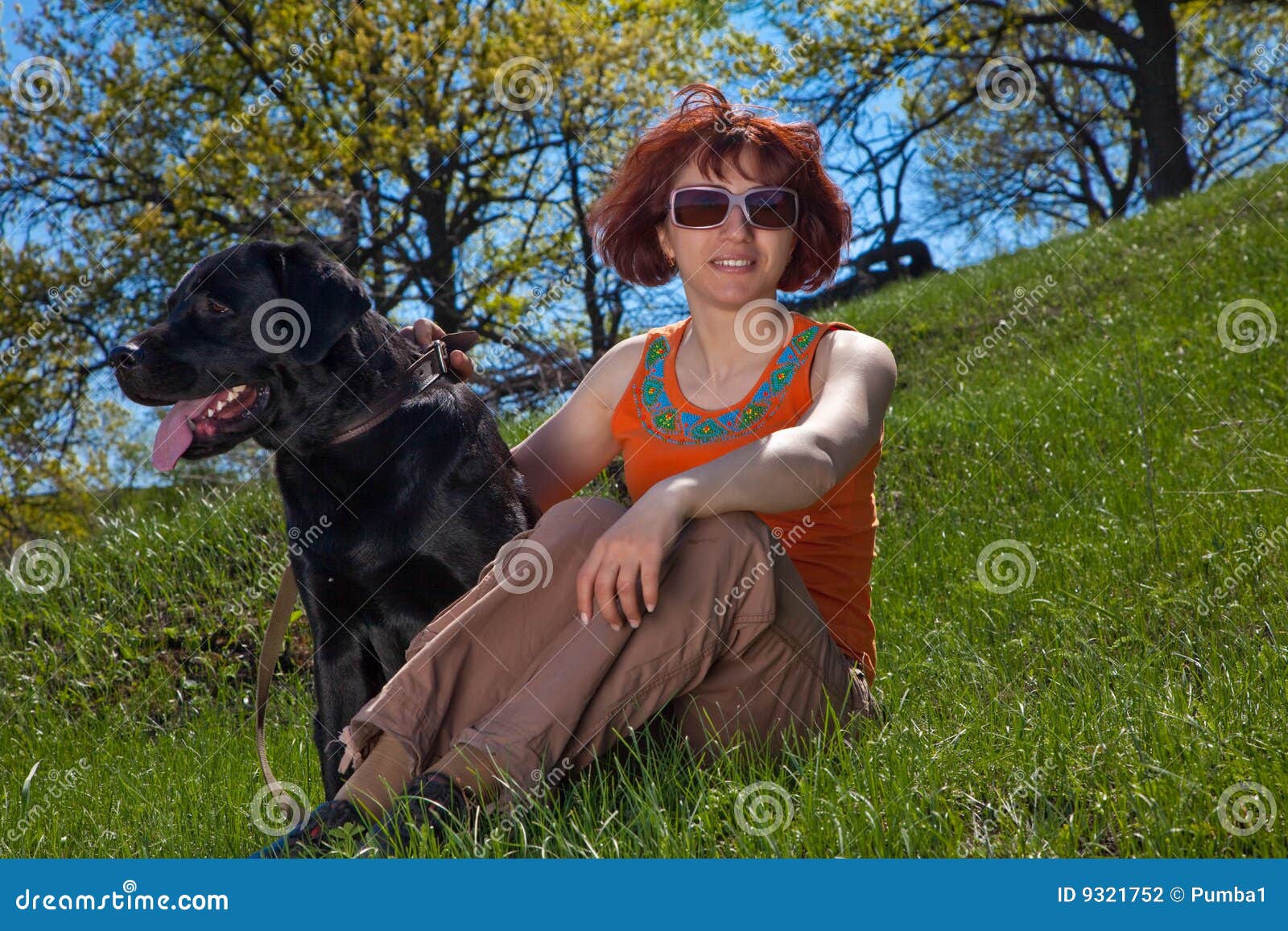 The Woman with Black Labrador Stock Photo - Image of retriever, sits ...
