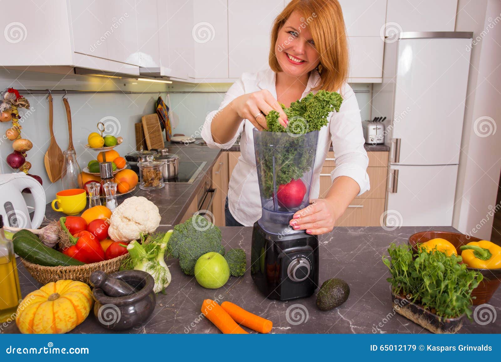 Woman blending vegetables stock image. Image of juicing - 65012179