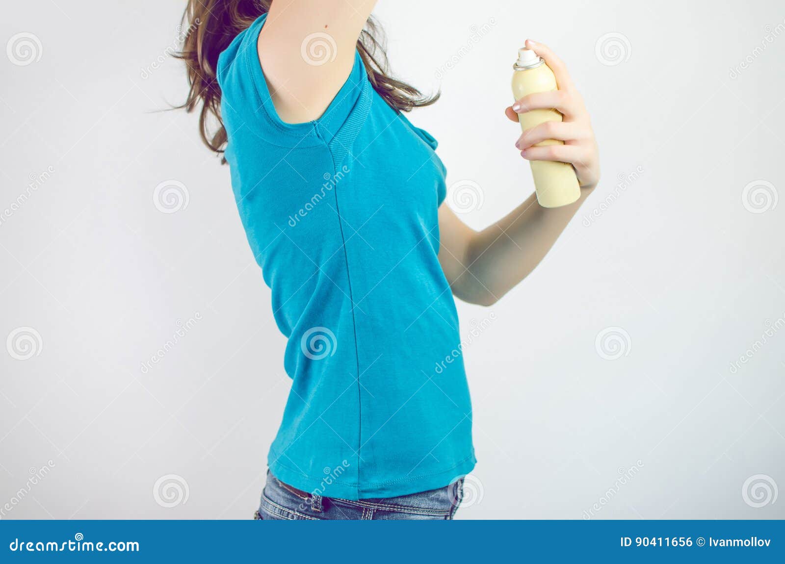 Woman in Blue Using a Spray Deodorant Stock Photo - Image of freshness ...