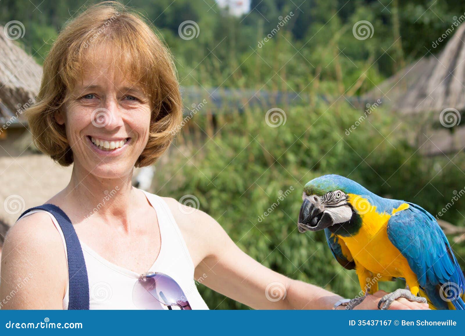 Woman with Blue-and-yellow Macaw Stock Image - Image of beak, crooked ...