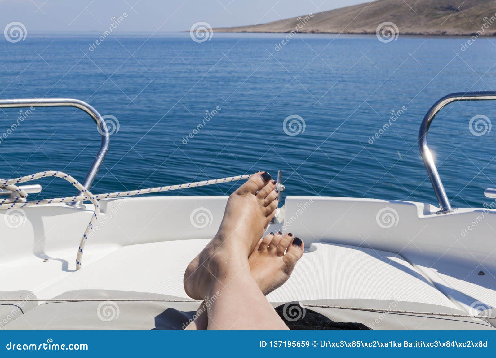 Woman on a boat stock image. Image of foot, ocean, adventure - 137195659