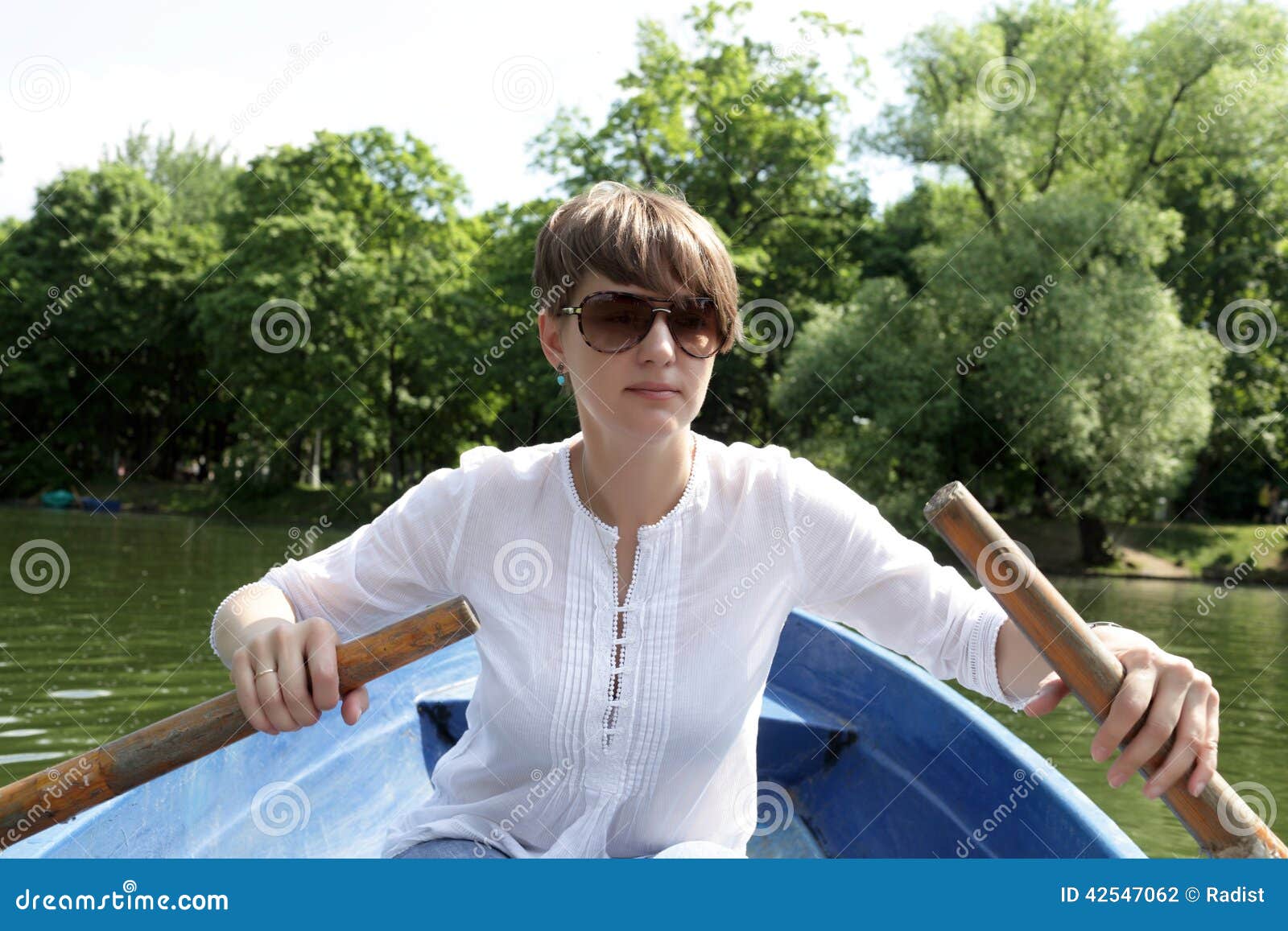 Woman in a boat stock photo. Image of outdoor, green - 42547062