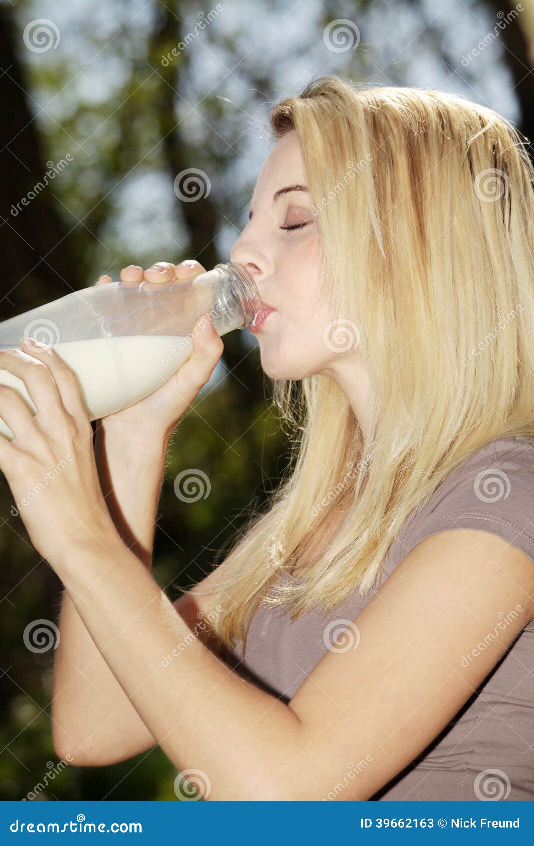 Woman with a Bottle of Milk Stock Image - Image of cute, bowl: 39662163