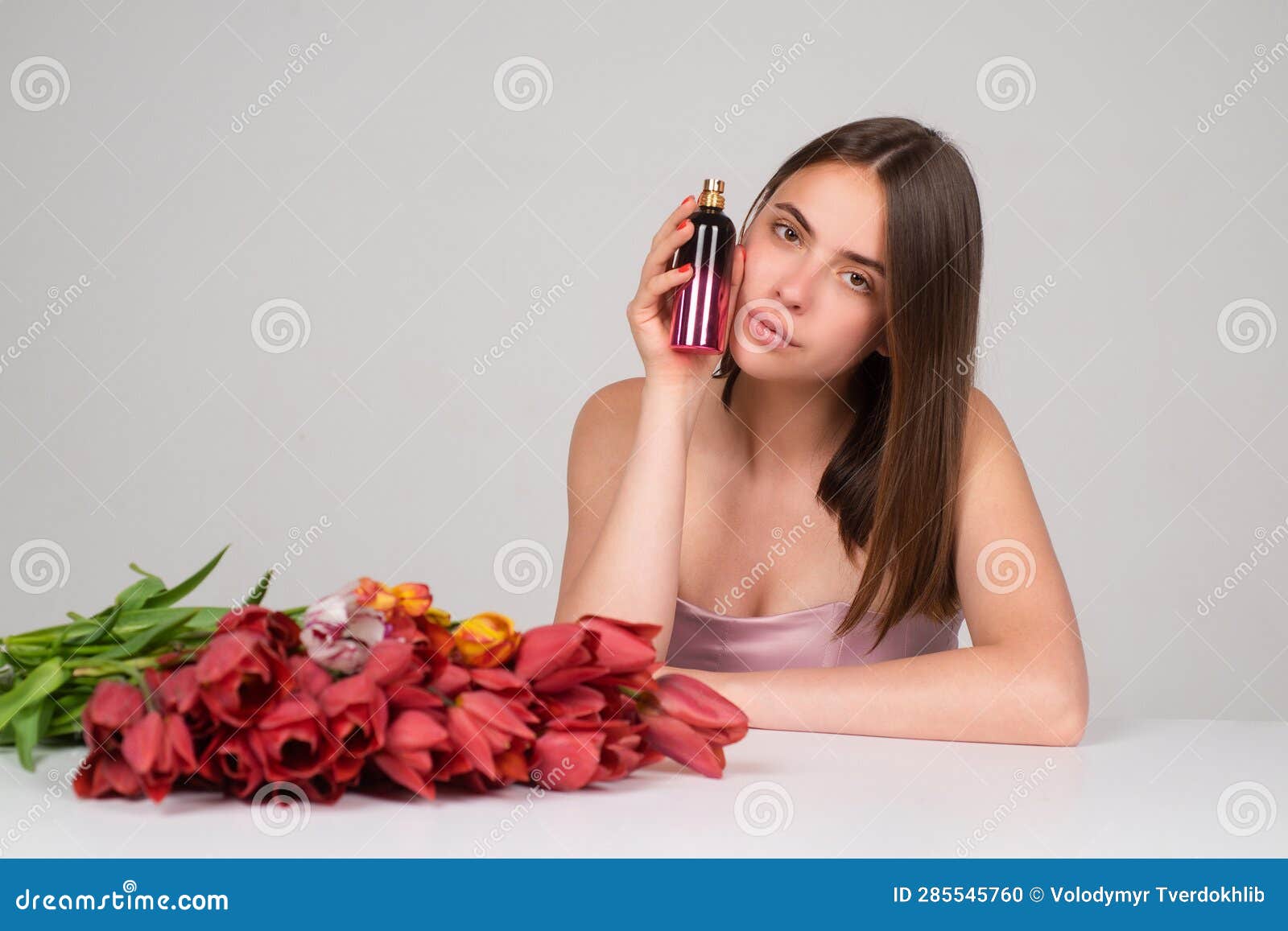 Woman with Bottle of Perfume Smelling Aroma. Stock Photo - Image of ...