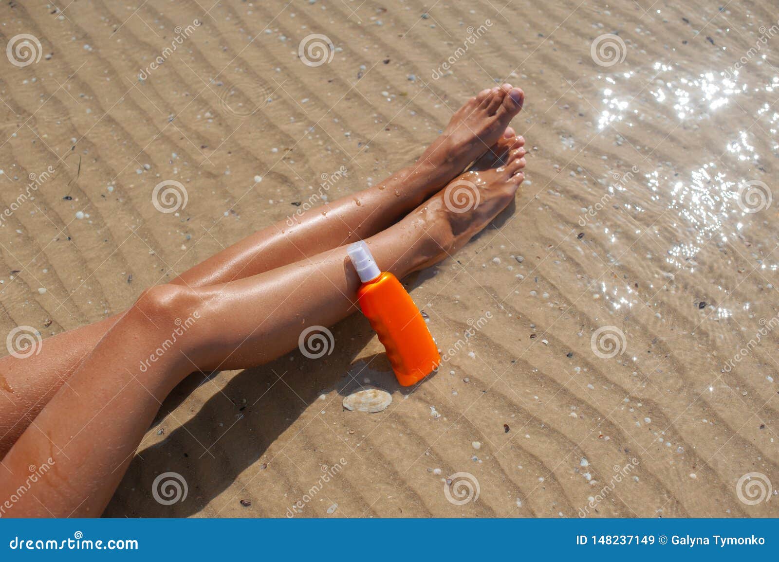 Woman With Bottles Of Sunscreen Near Her Hands Skincare Sunblock Sun
