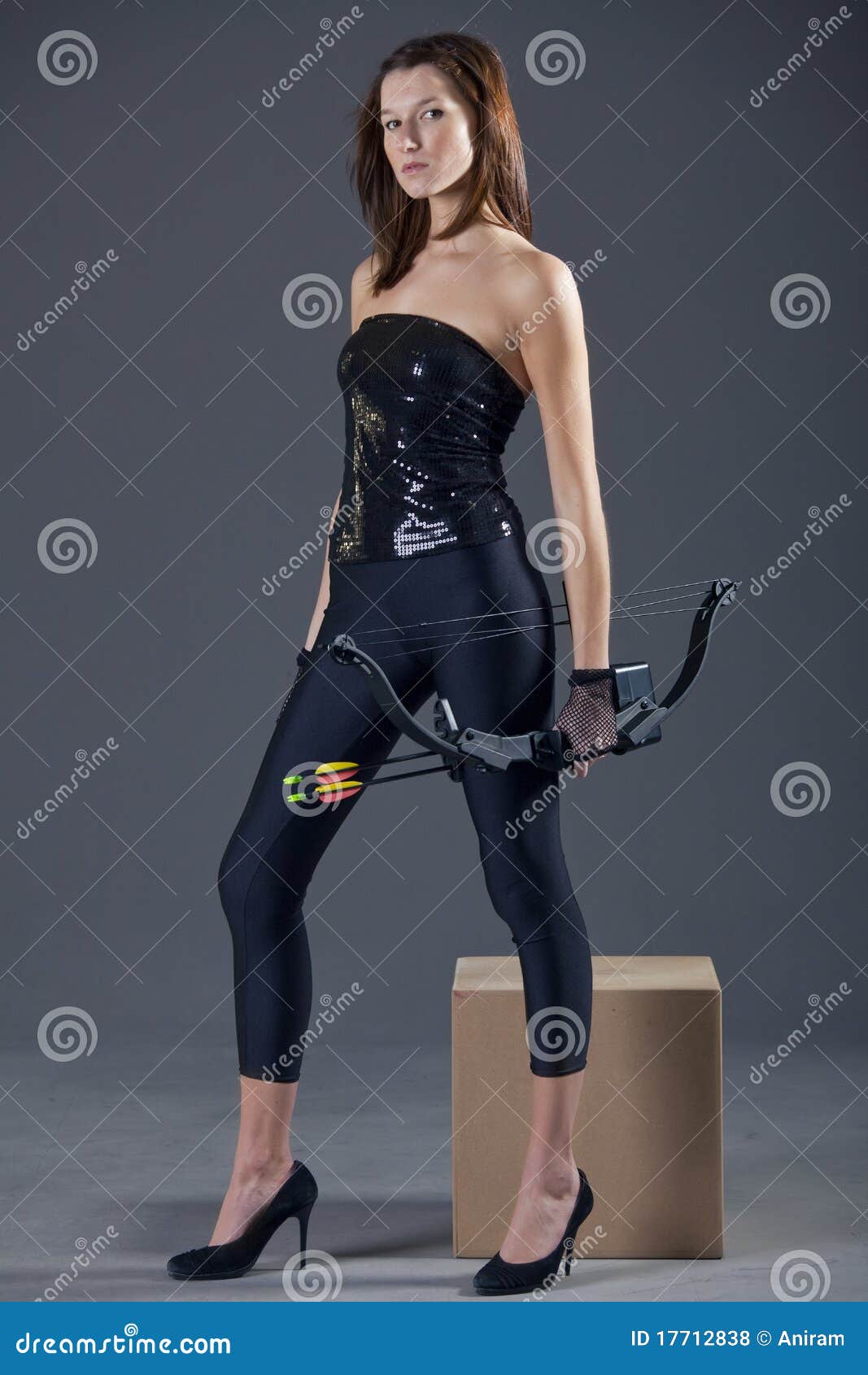 Woman with bow stock photo. Image of shooting, young - 17712838