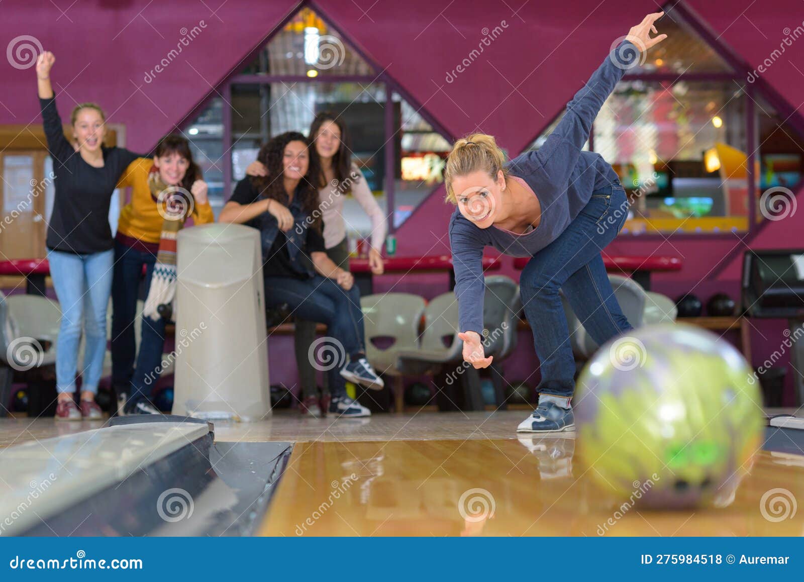 Woman bowling with friends stock photo. Image of young - 275984518