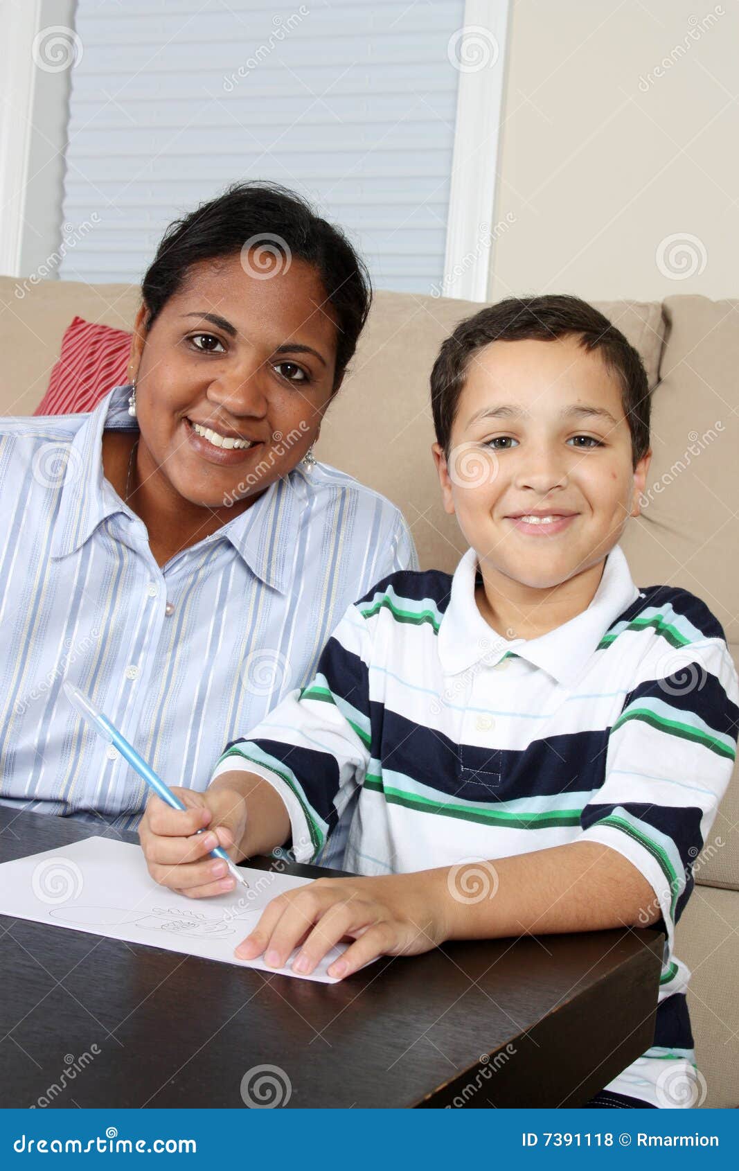 Woman and Boy Writing stock photo. Image of smiling, education - 7391118