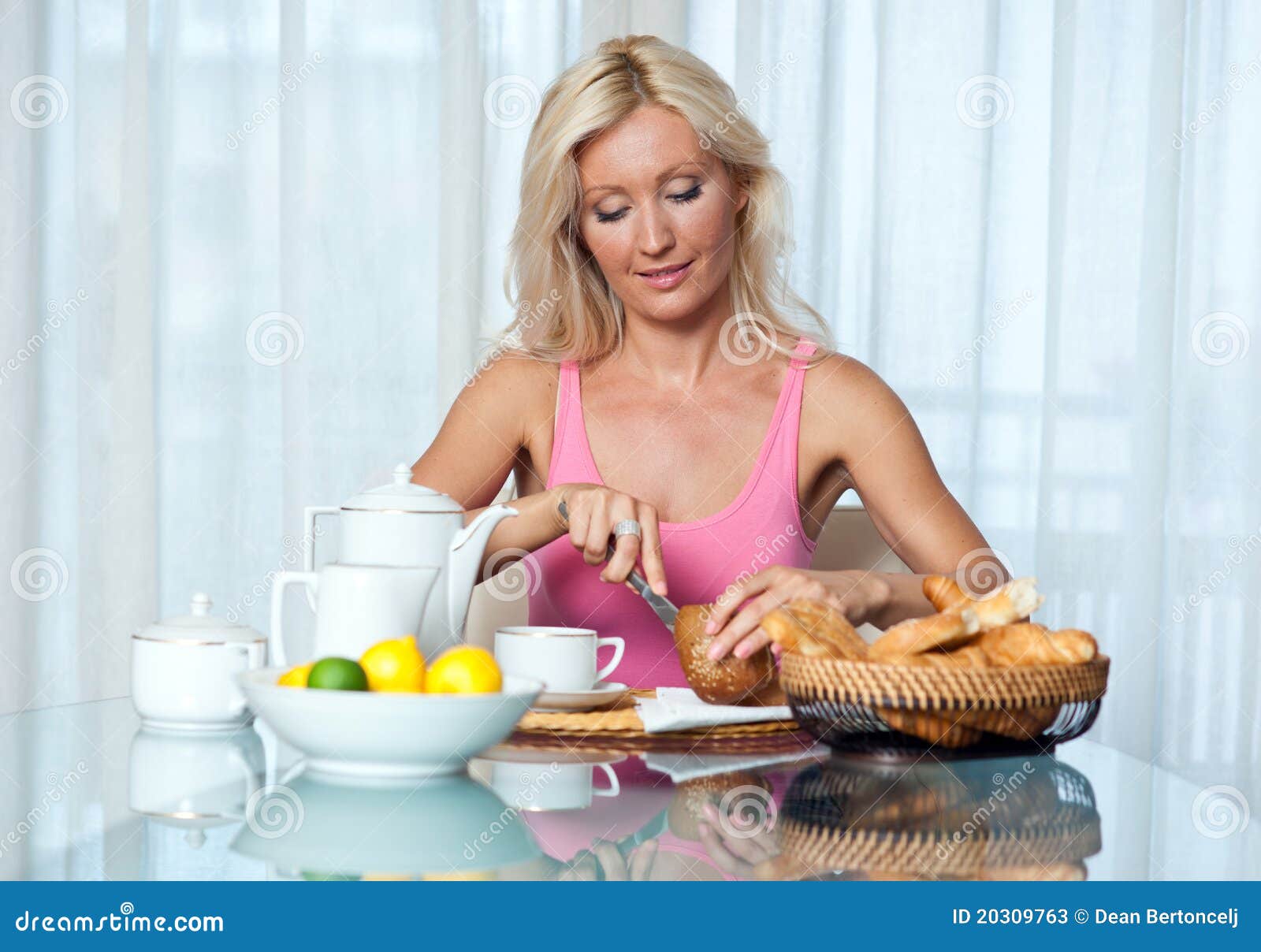Woman at breakfast stock image. Image of indoors, mature - 20309763