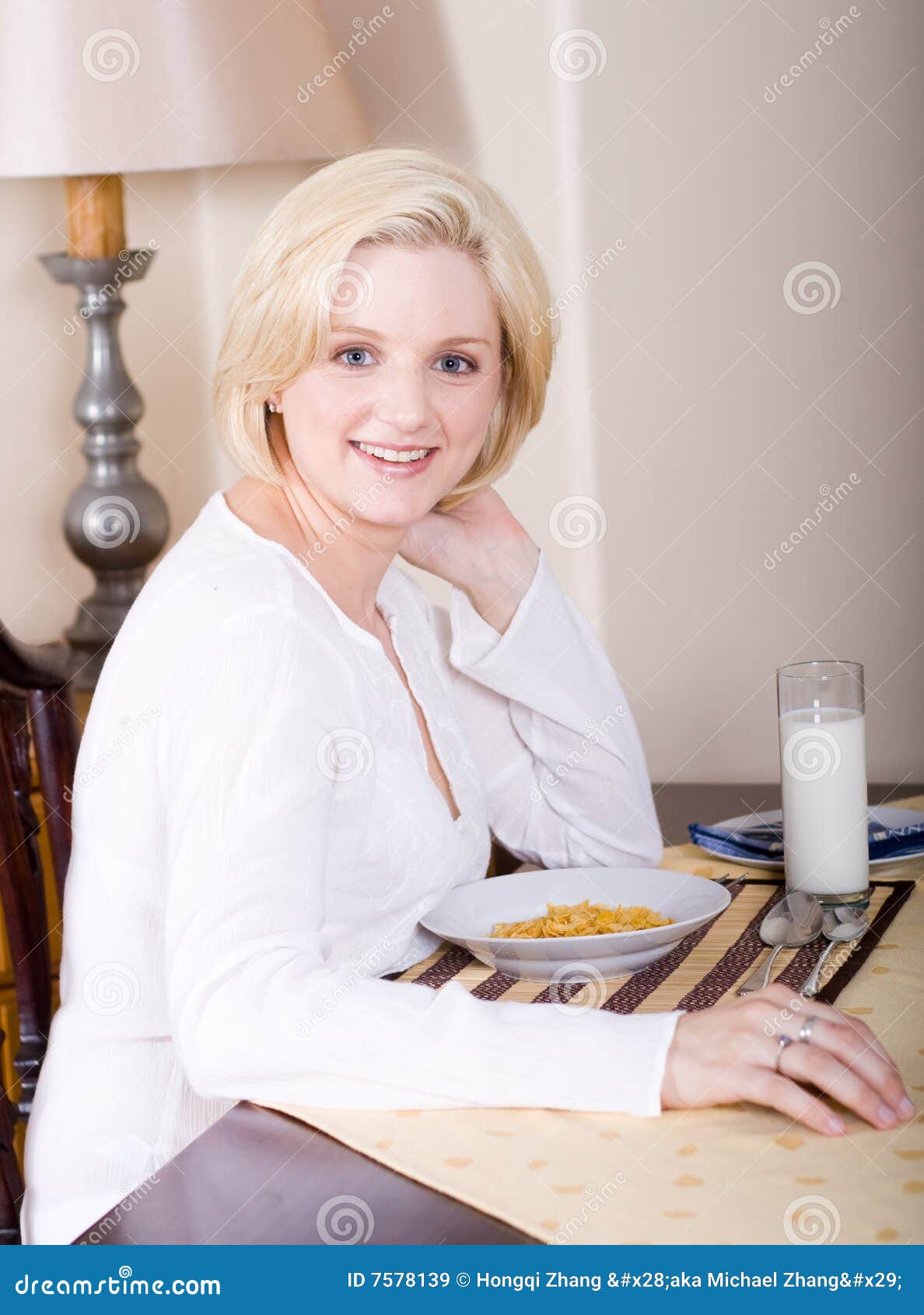 Woman at breakfast table stock image. Image of food, flakes - 7578139