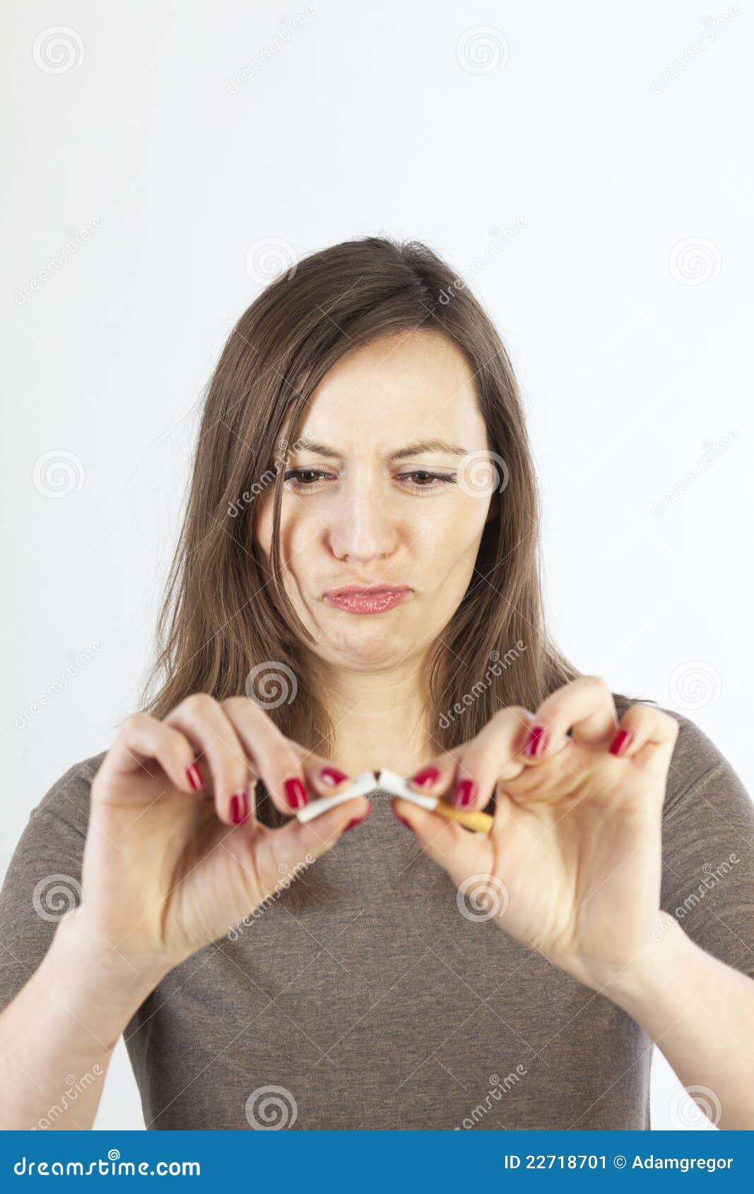 Woman breaking a cigarette stock image. Image of product - 22718701