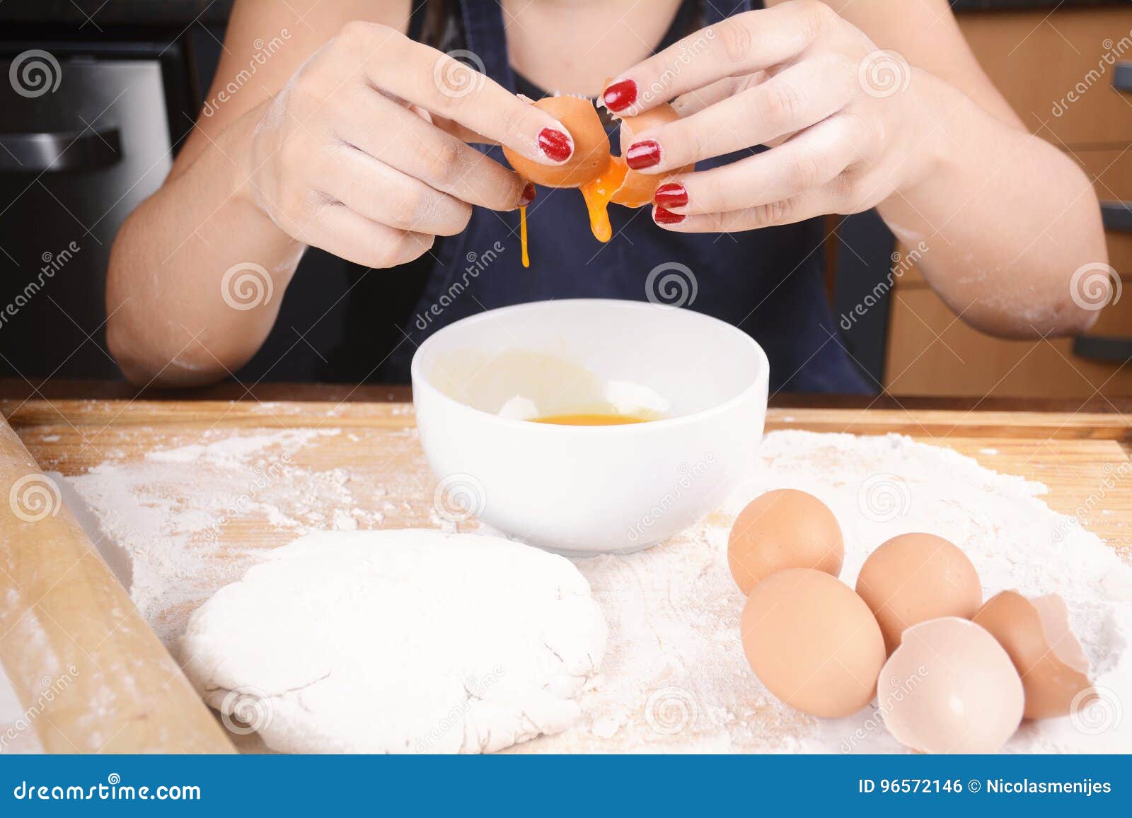 Woman Breaking an Egg into Bowl. Stock Photo - Image of eggs, flour ...