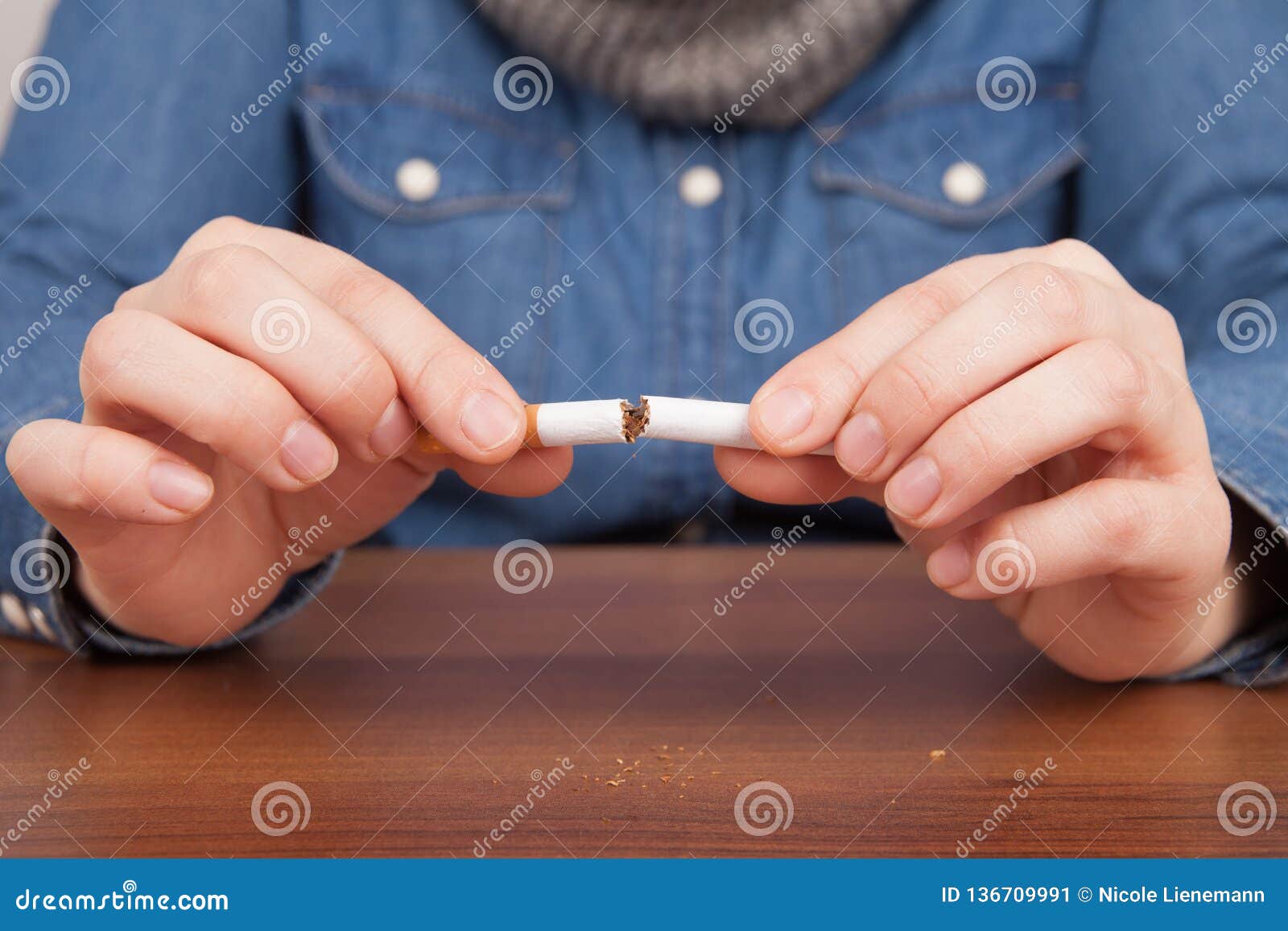 Woman breaks a cigarette stock image. Image of isolated - 136709991