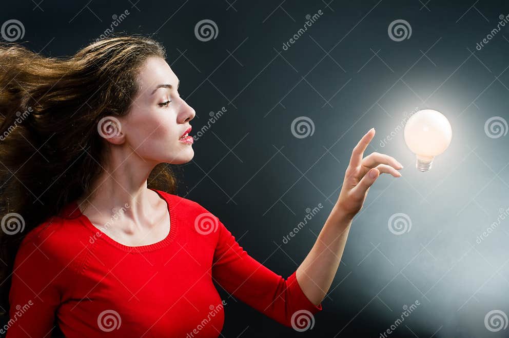 Woman and Bright Light Bulb Stock Photo - Image of women, adult: 6376906