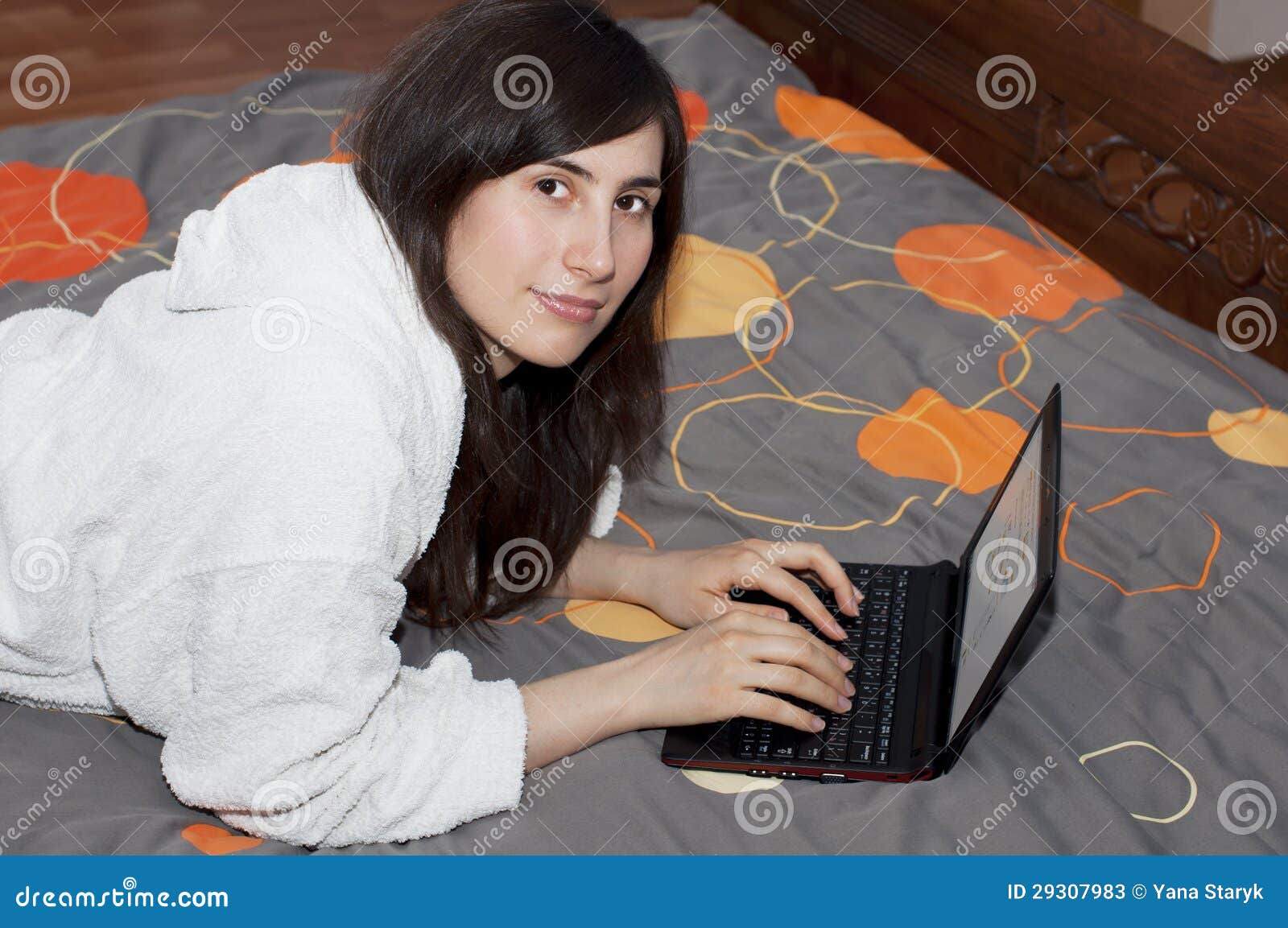 Woman Browsing the Internet while Lying in Bed Stock Image - Image of ...