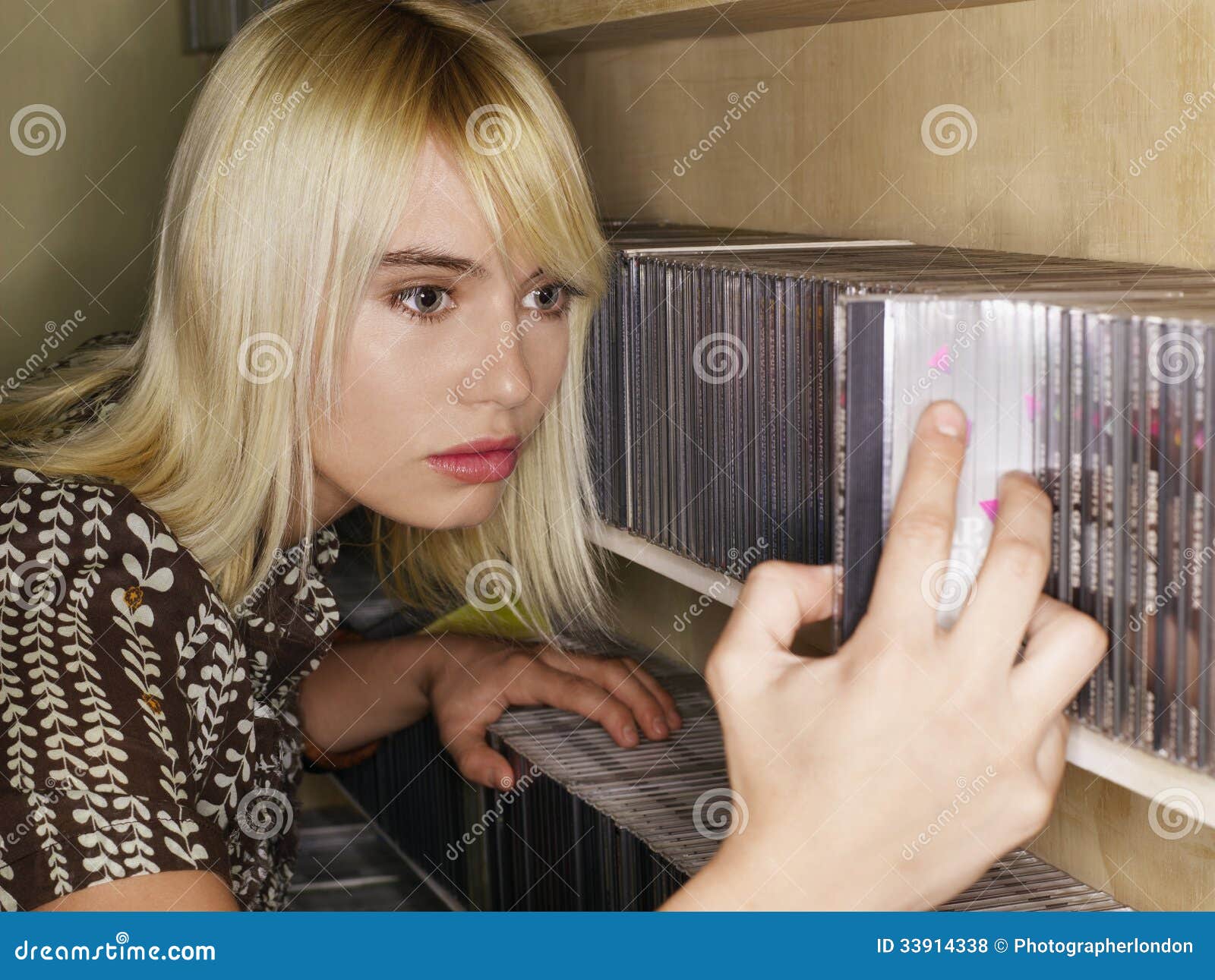Woman Browsing in a Music Store Stock Photo - Image of looking, person ...