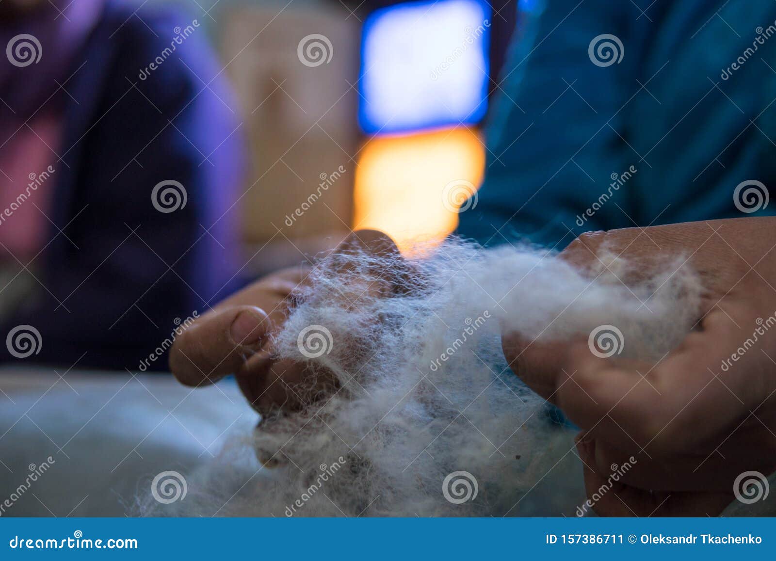 Woman with Brushes Preparing a Wool for Spining a Woolen String for ...