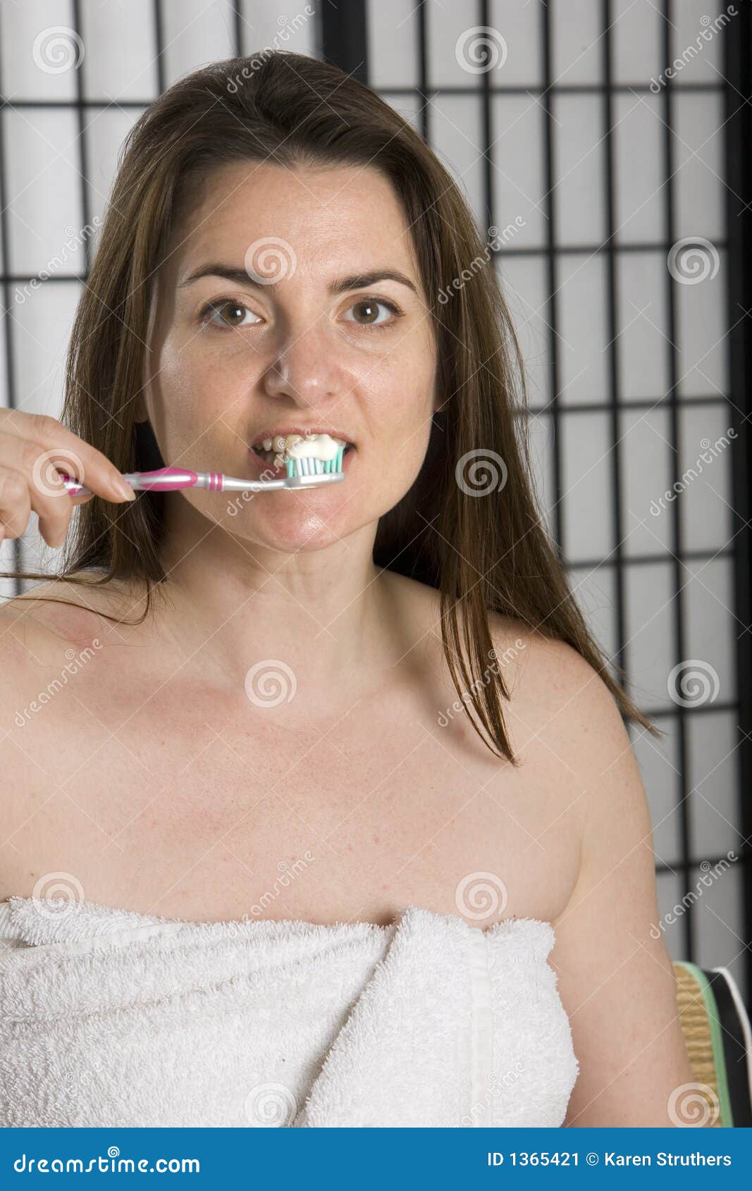 Woman brushing her teeth stock image. Image of clean, products - 1365421