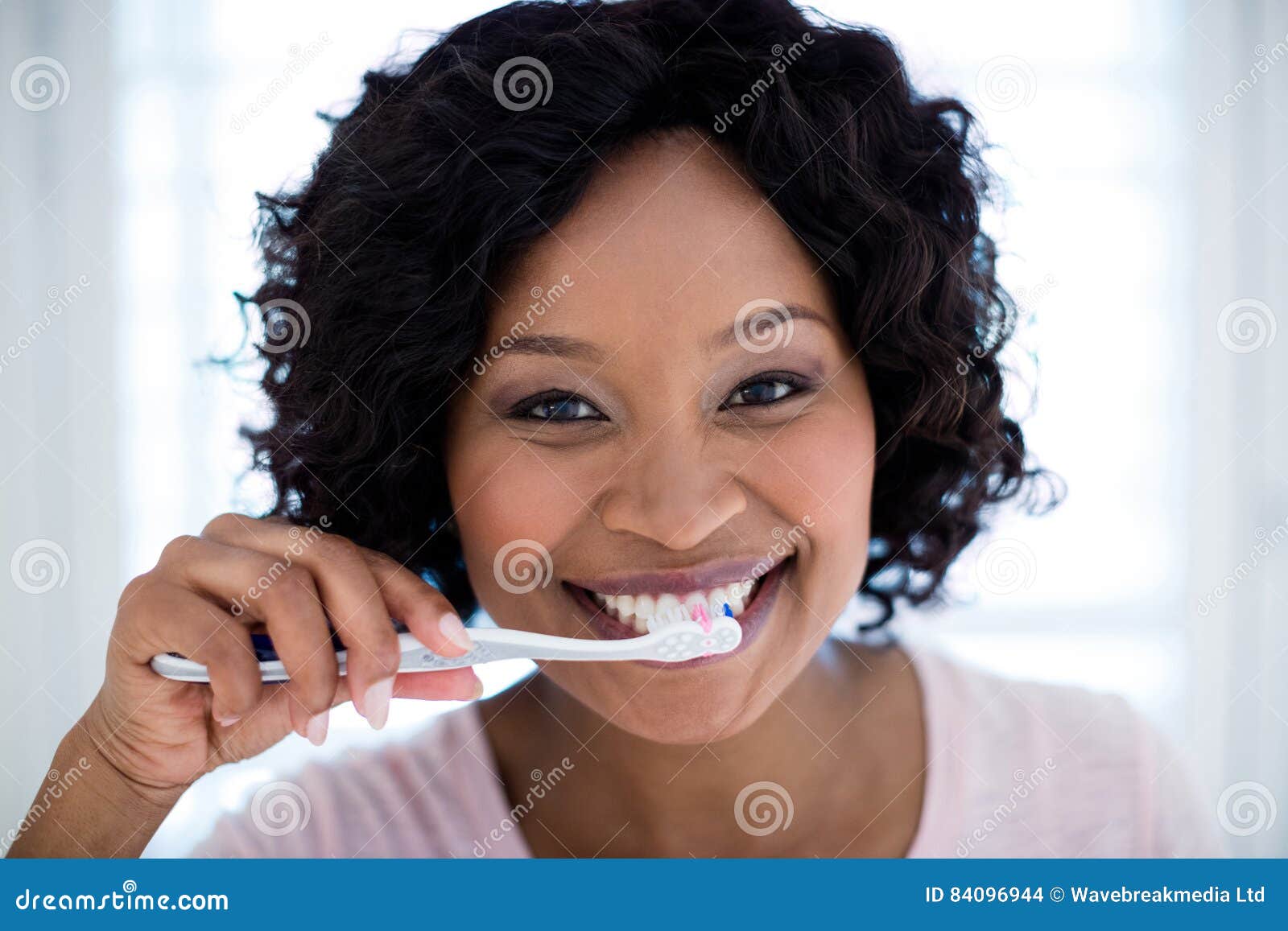 Woman brushing her teeth stock photo. Image of beautiful - 84096944