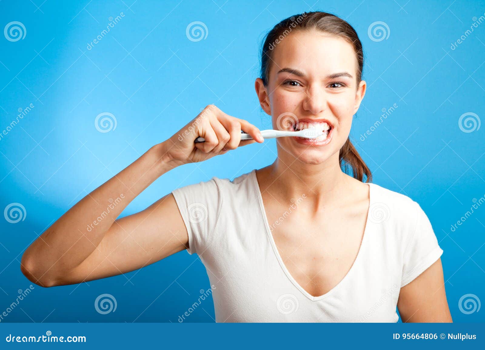 Woman Brushing Her Teeth stock photo. Image of toothpaste - 95664806