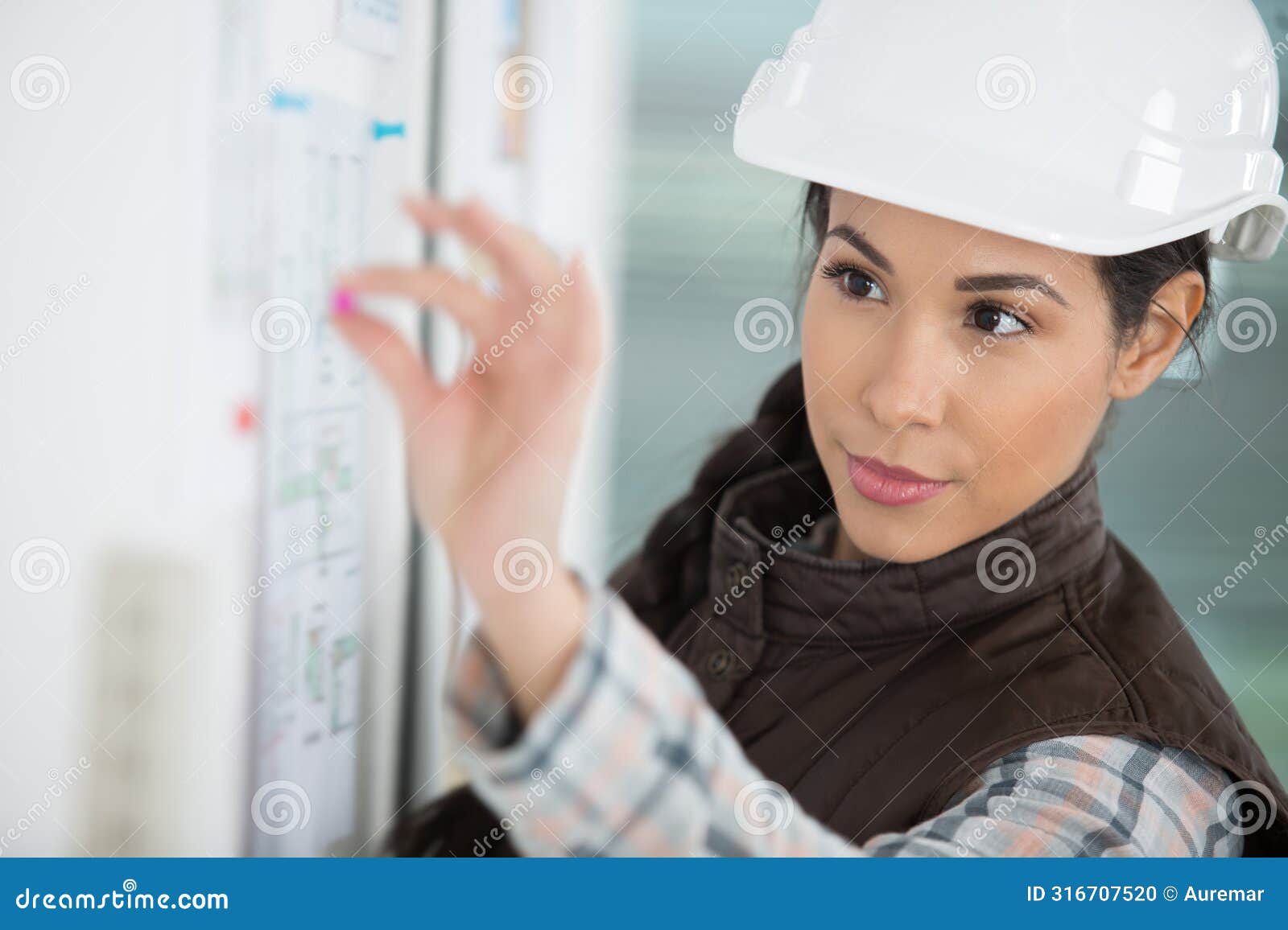 Woman Builder in Helmet Looking at Work Plan Stock Photo - Image of ...