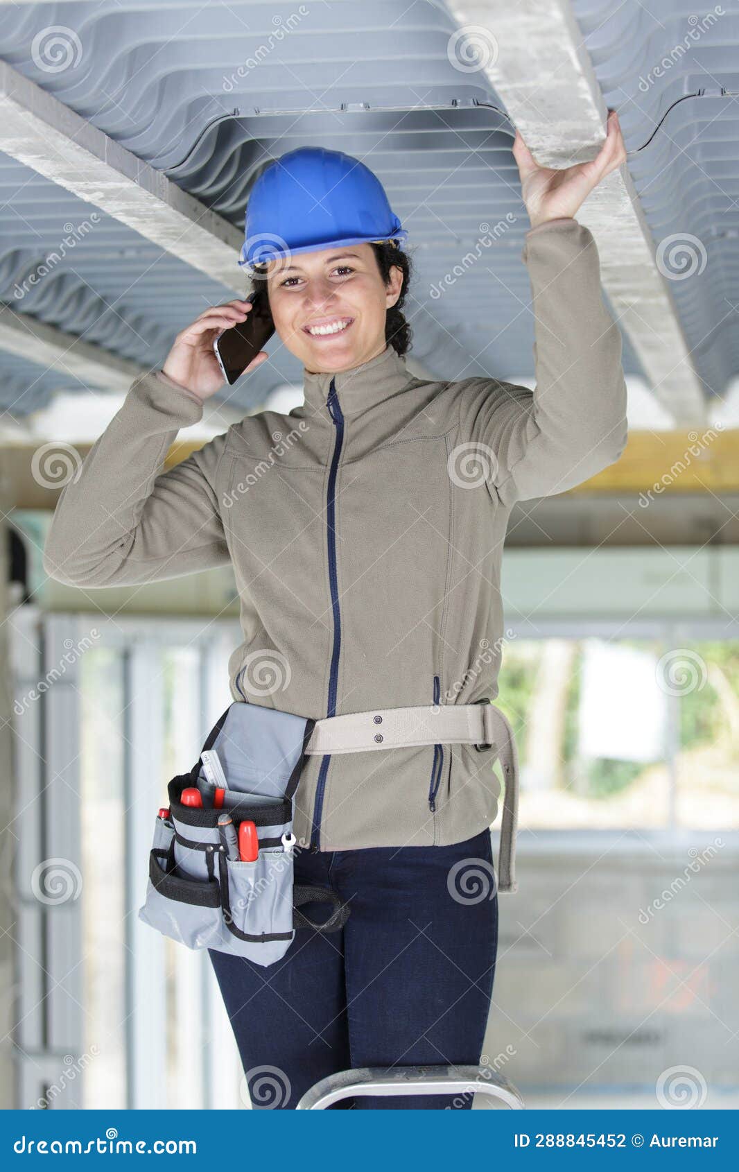 Woman Builder on Phone Installing Ceiling Stock Photo - Image of ...