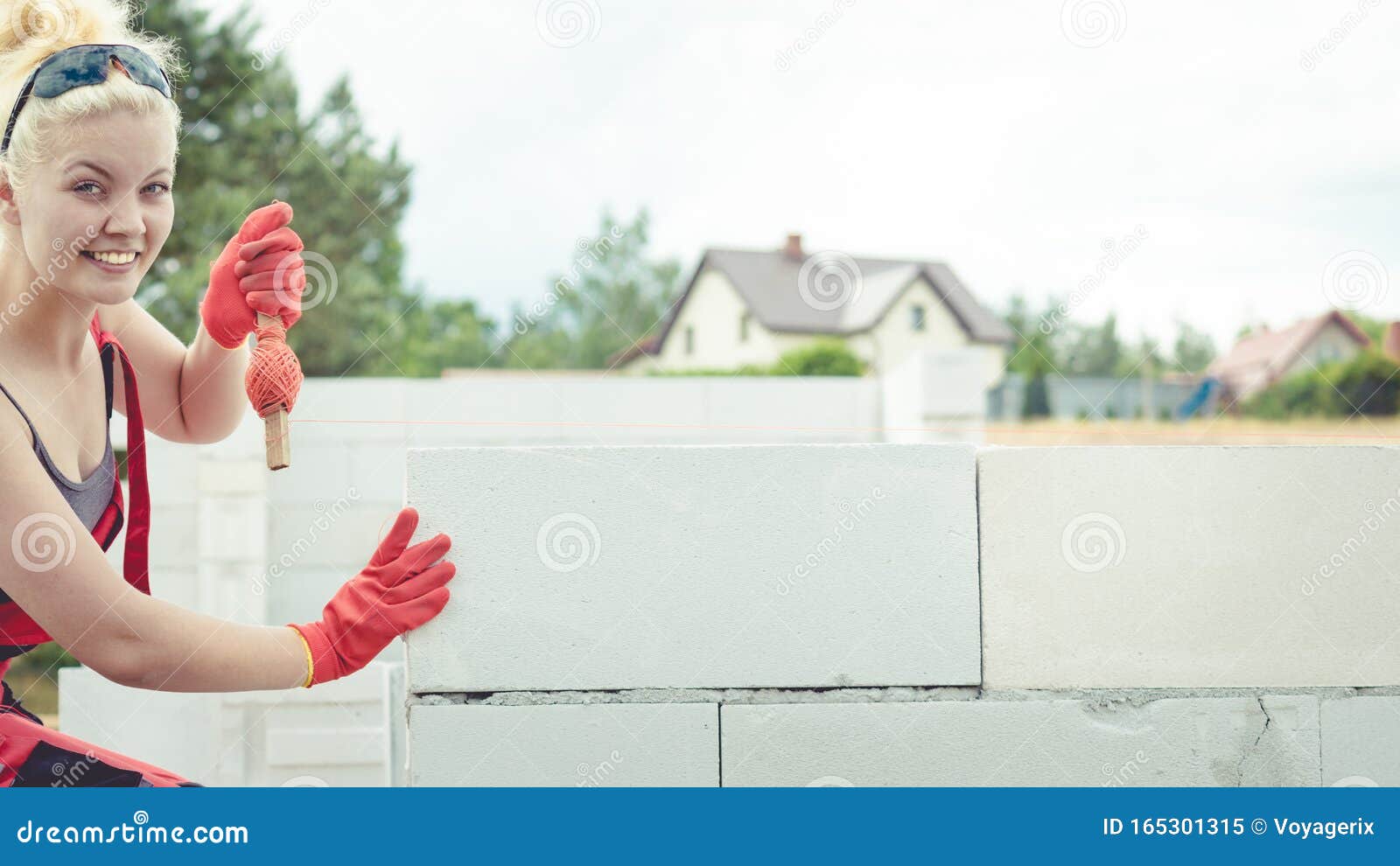 Woman Using String As Level in Wall Construction Stock Image - Image of ...