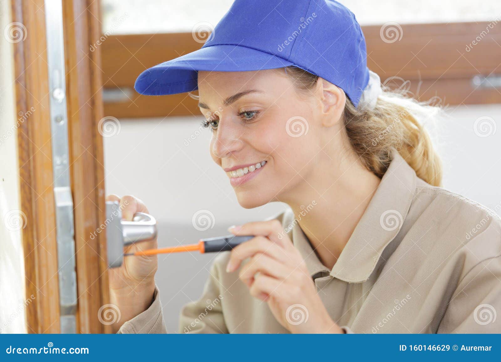 Woman Builder Working Using Screwdriver and Fix Door Stock Image ...