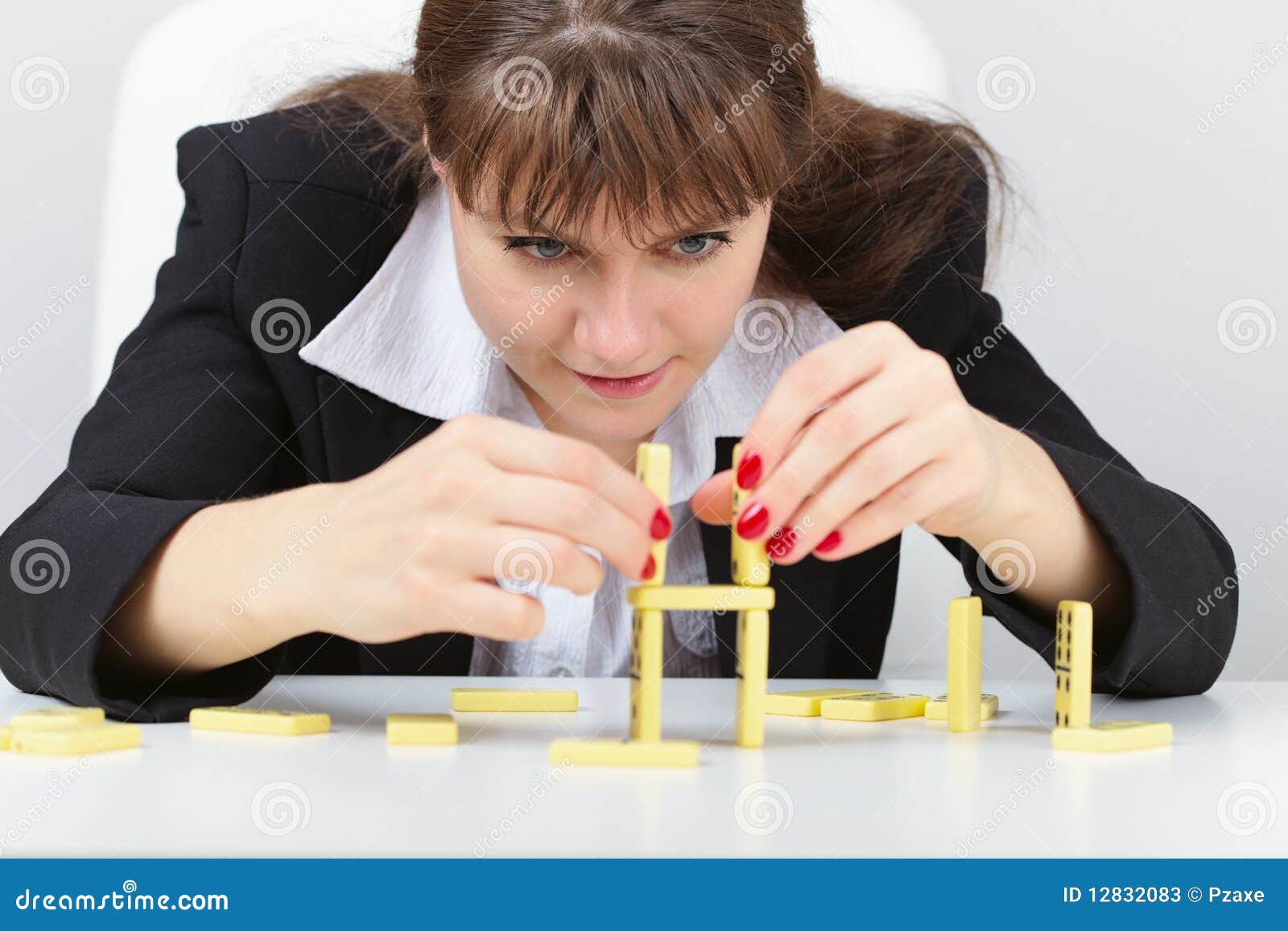 Woman Building a Tower on Table with Domino Stock Image - Image of ...