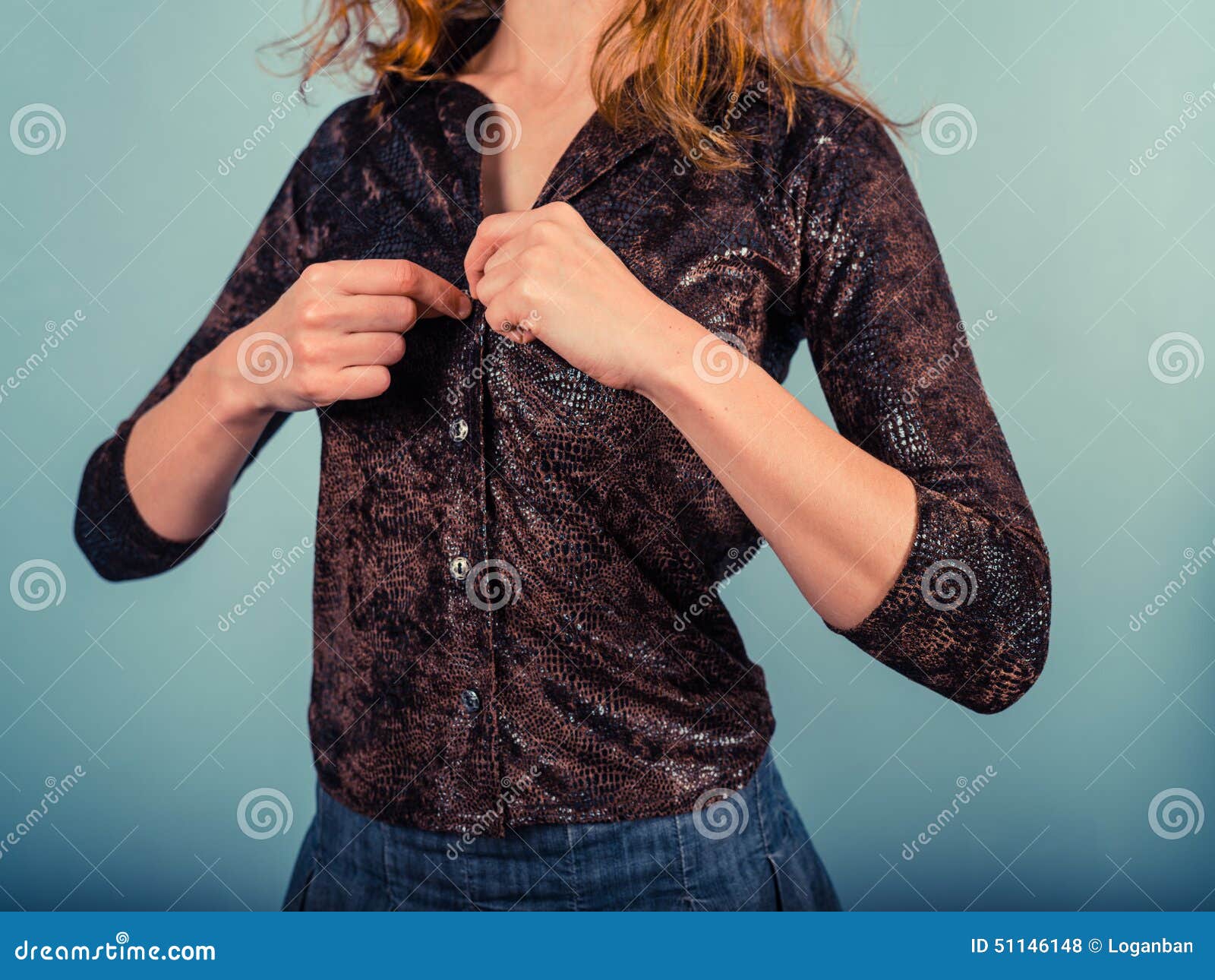 Woman buttoning her shirt stock photo. Image of clothes - 51146148