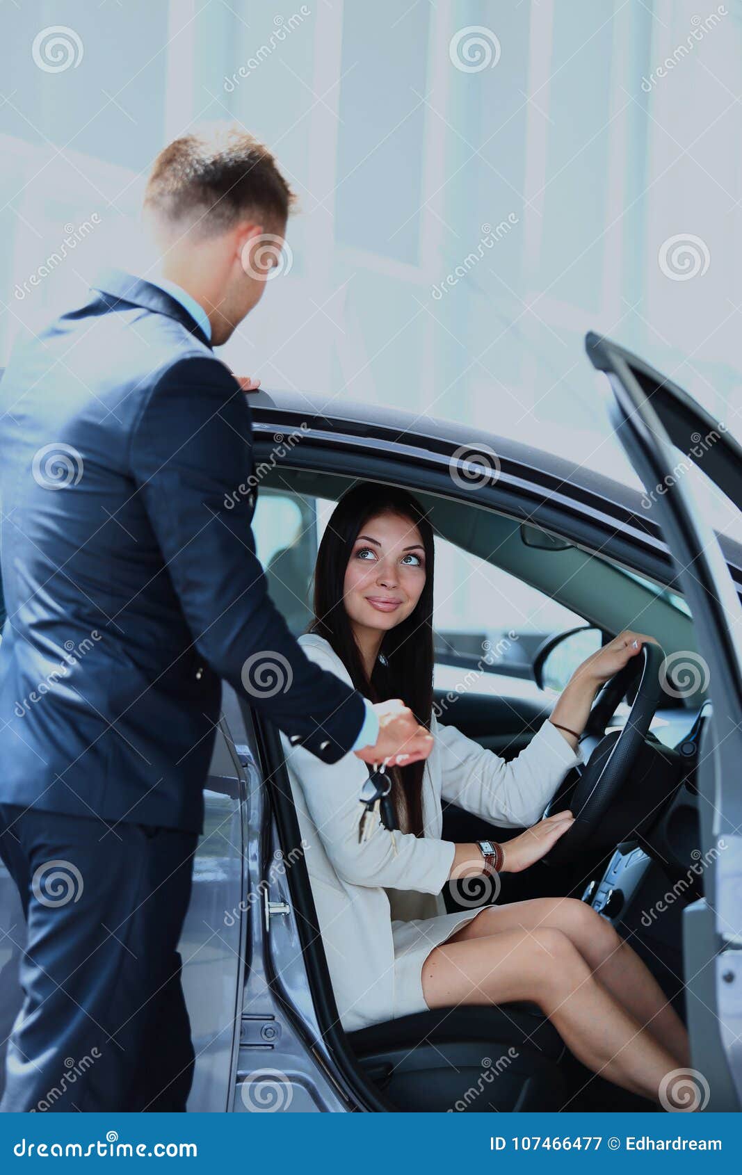 Woman buying a new car. stock image. Image of concessionaire - 107466477