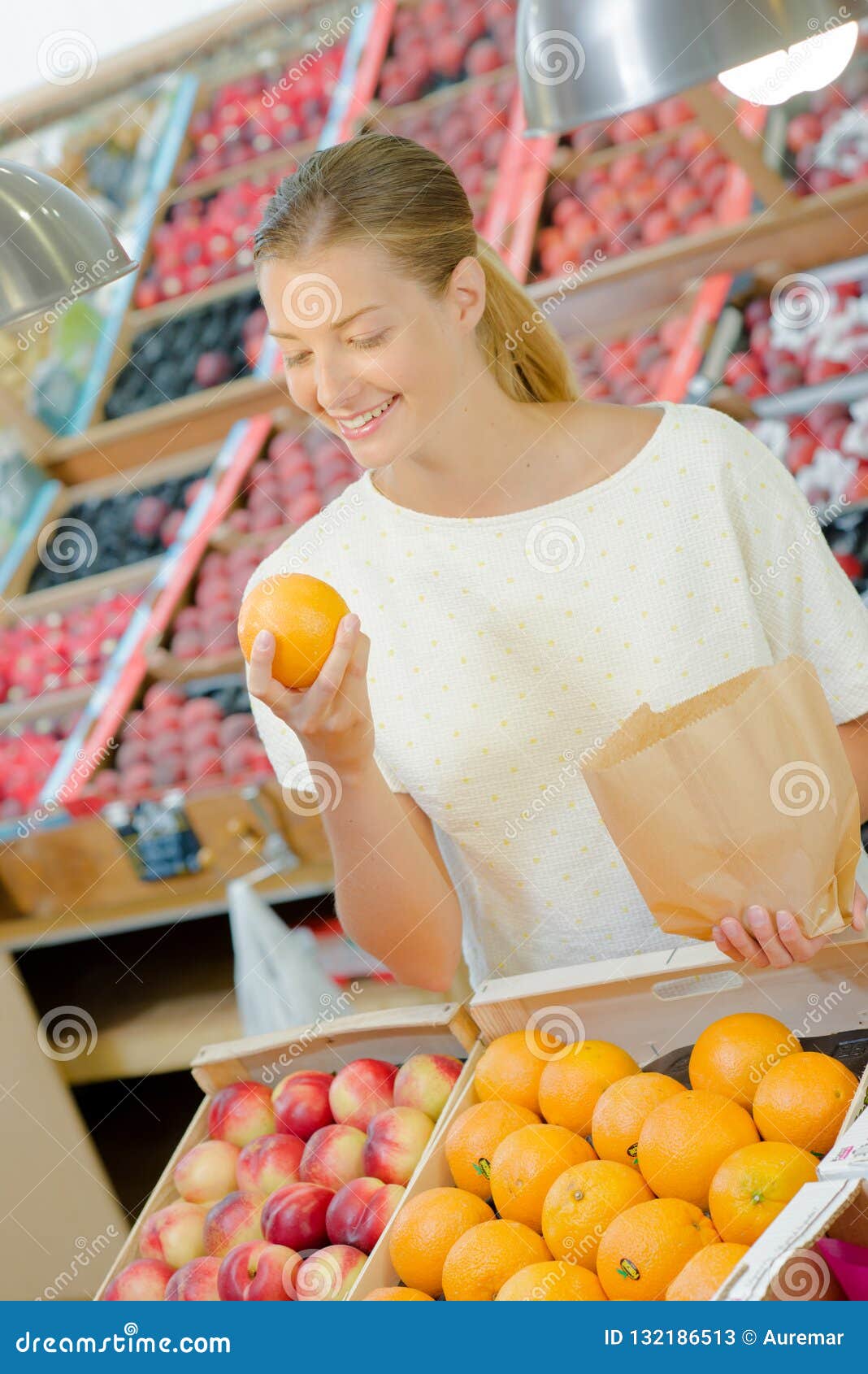 Woman buying some oranges stock image. Image of spring - 132186513