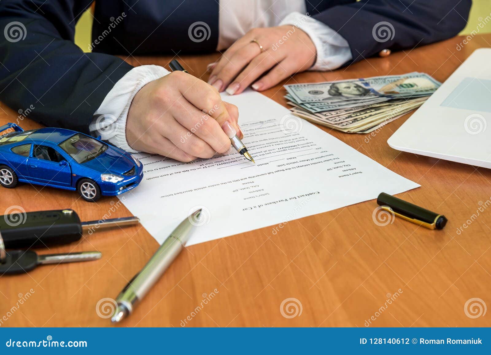 Woman buys a car signing stock photo. Image of office - 128140612
