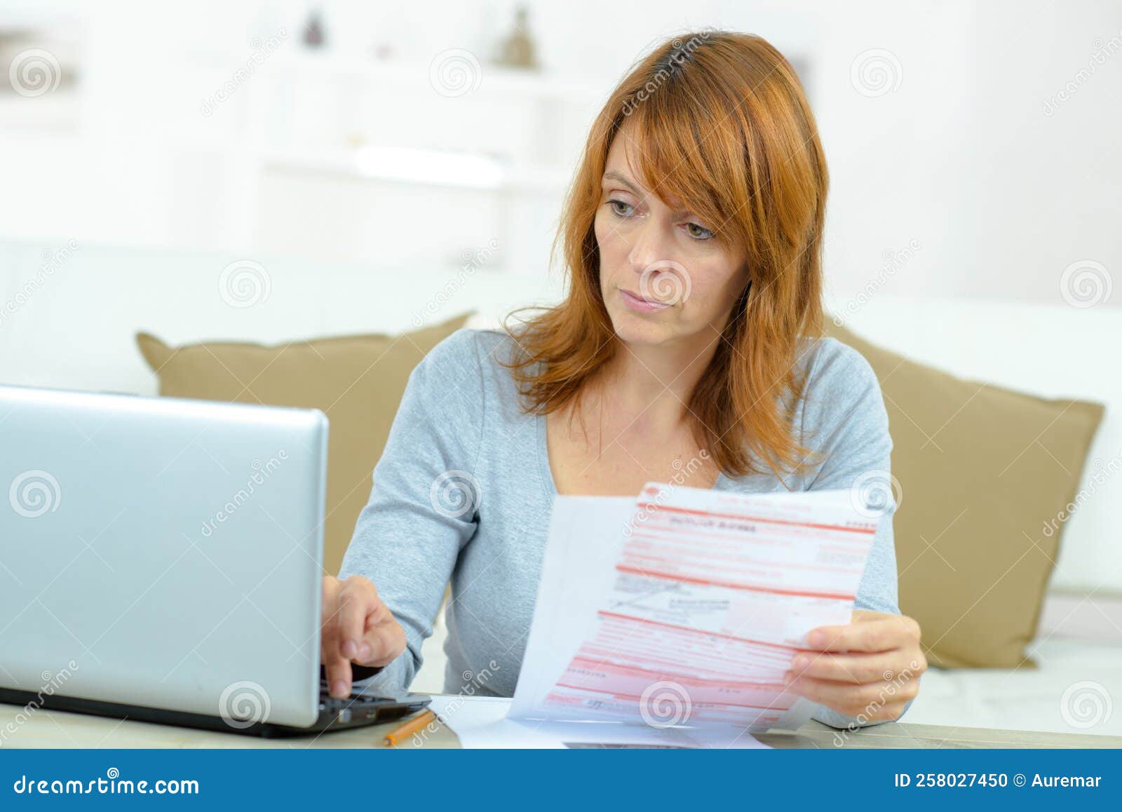 Woman calculating finances stock photo. Image of home - 258027450