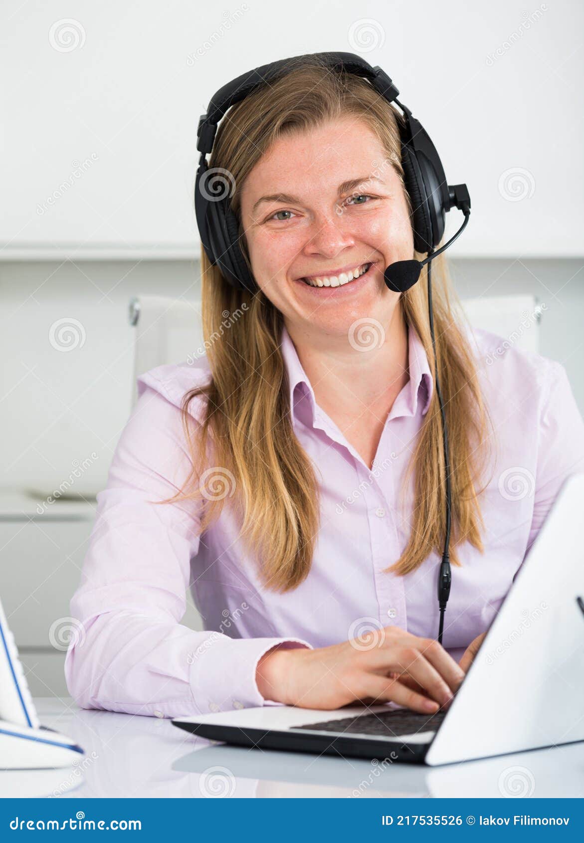Woman in call-center stock photo. Image of sitting, productive - 217535526
