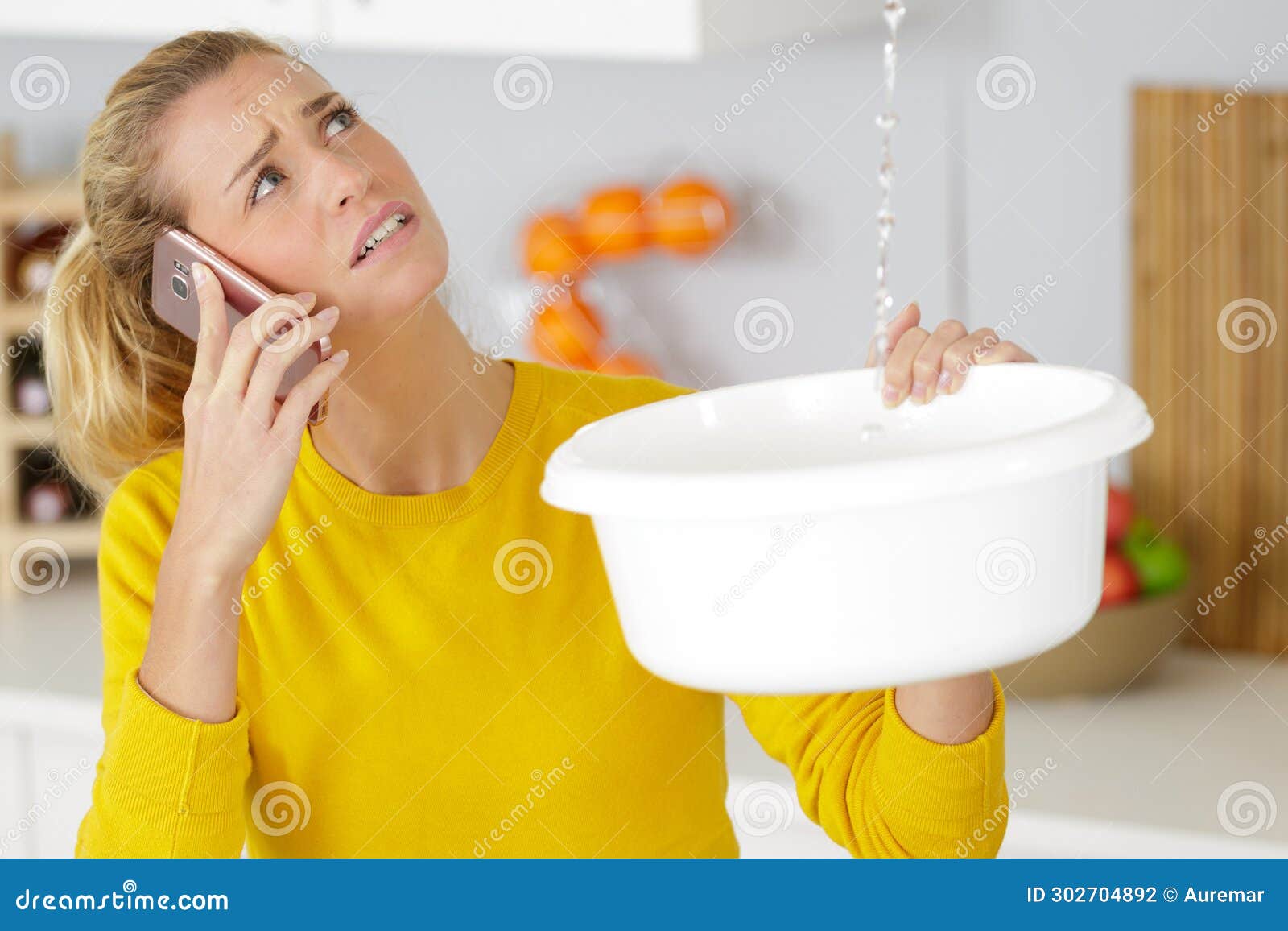Woman Calling To Plumber for Water Leakage Problem Stock Photo - Image ...