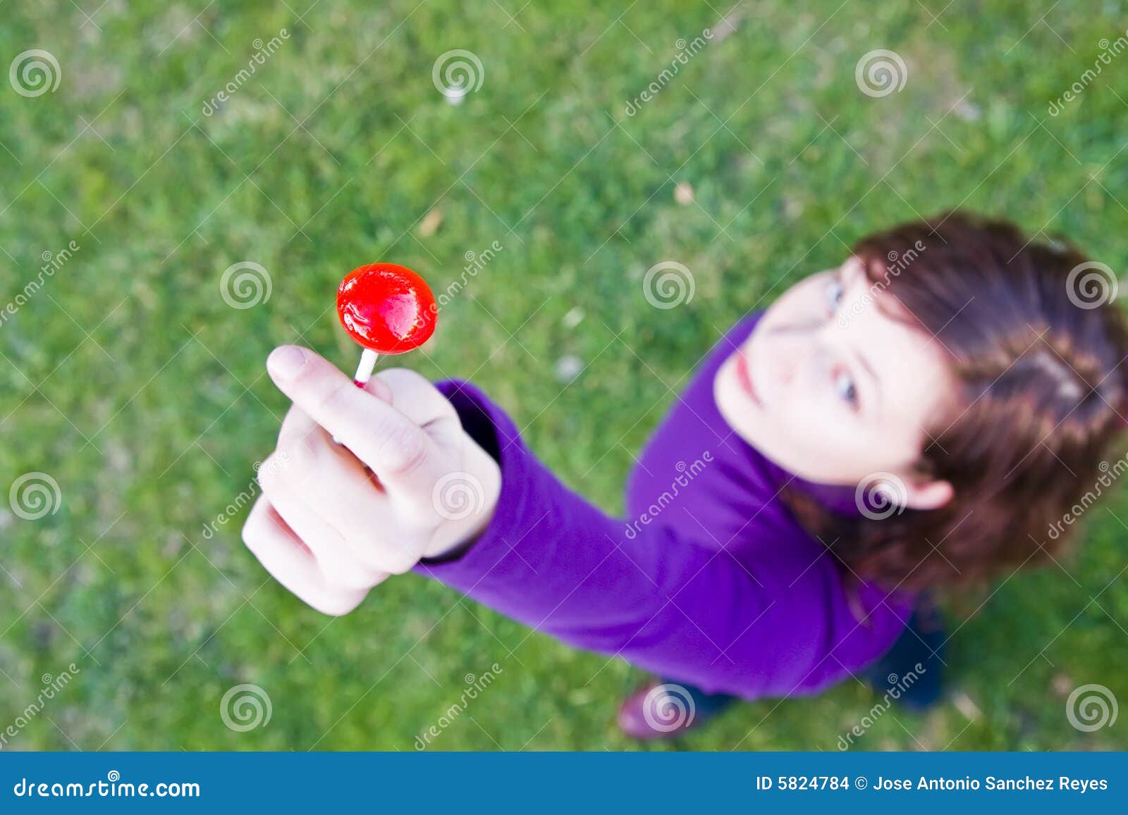 Woman with candy stock photo. Image of grass, hands, lollipop - 5824784
