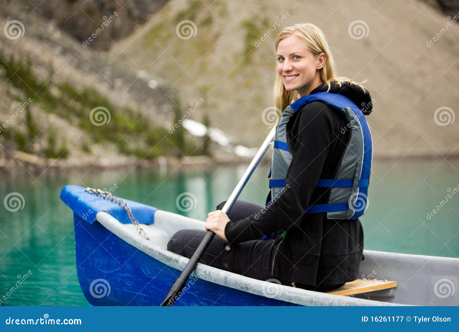 Woman Canoeing on Lake stock image. Image of caucasian - 16261177