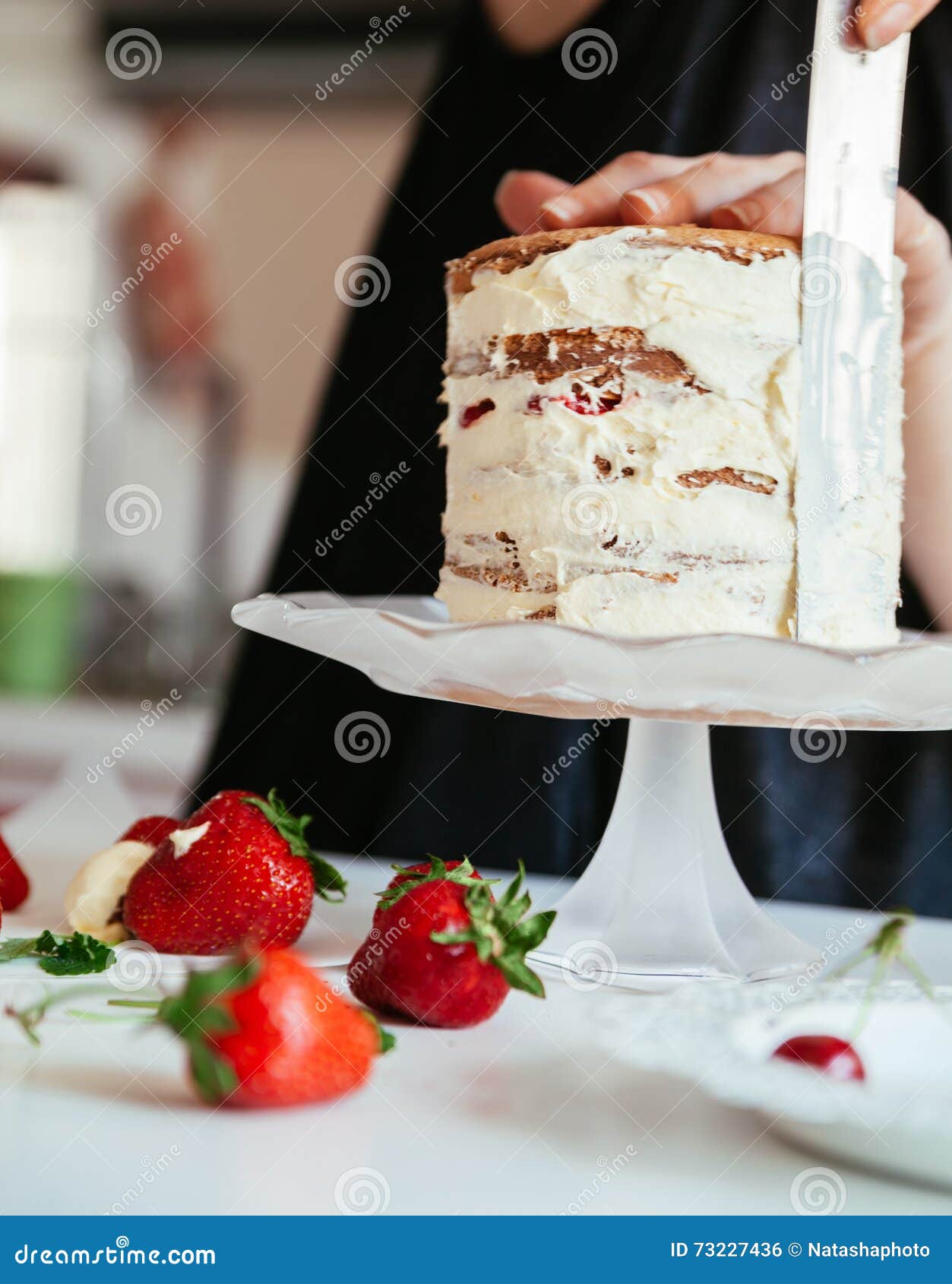 Woman Carefully Icing the Cake Stock Photo - Image of ethnicity, cream ...