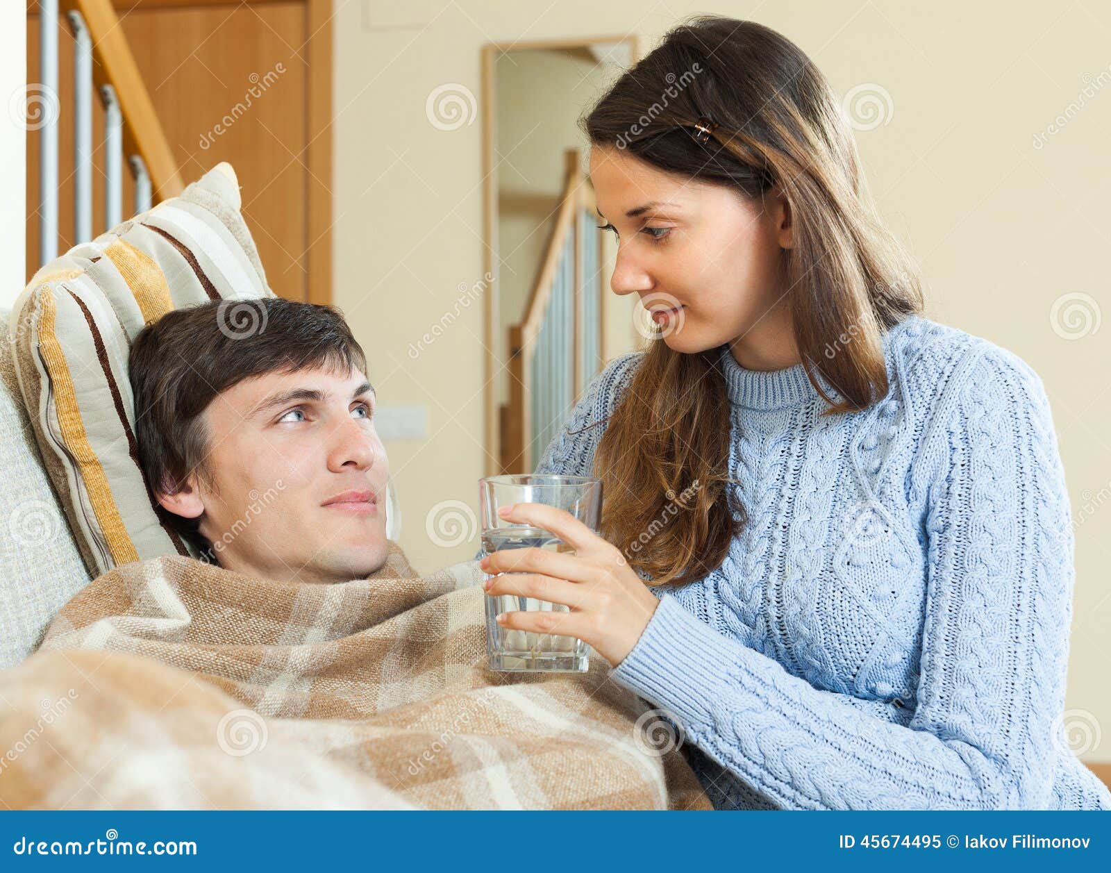 Woman caring for sick man stock image. Image of remedy - 45674495
