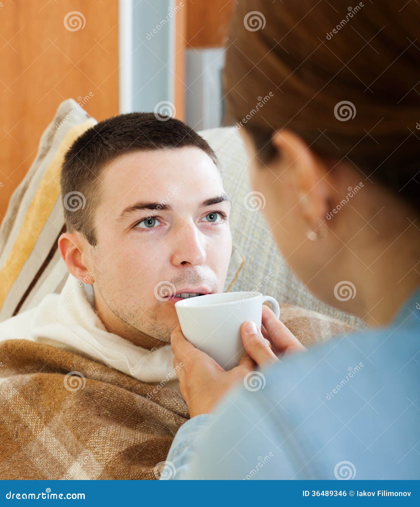 Woman Caring for Unwell Man Stock Photo - Image of family, patient ...