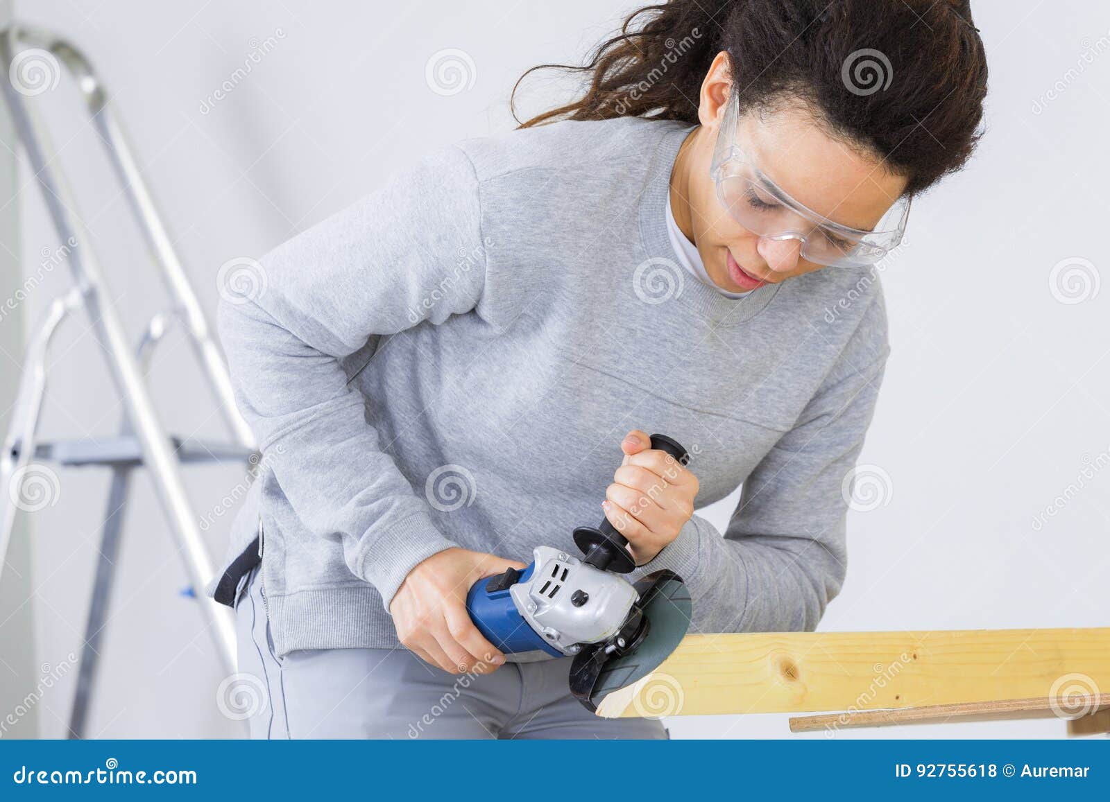 Woman Carpenter Using Angle Grinder Stock Photo - Image of mechanic ...