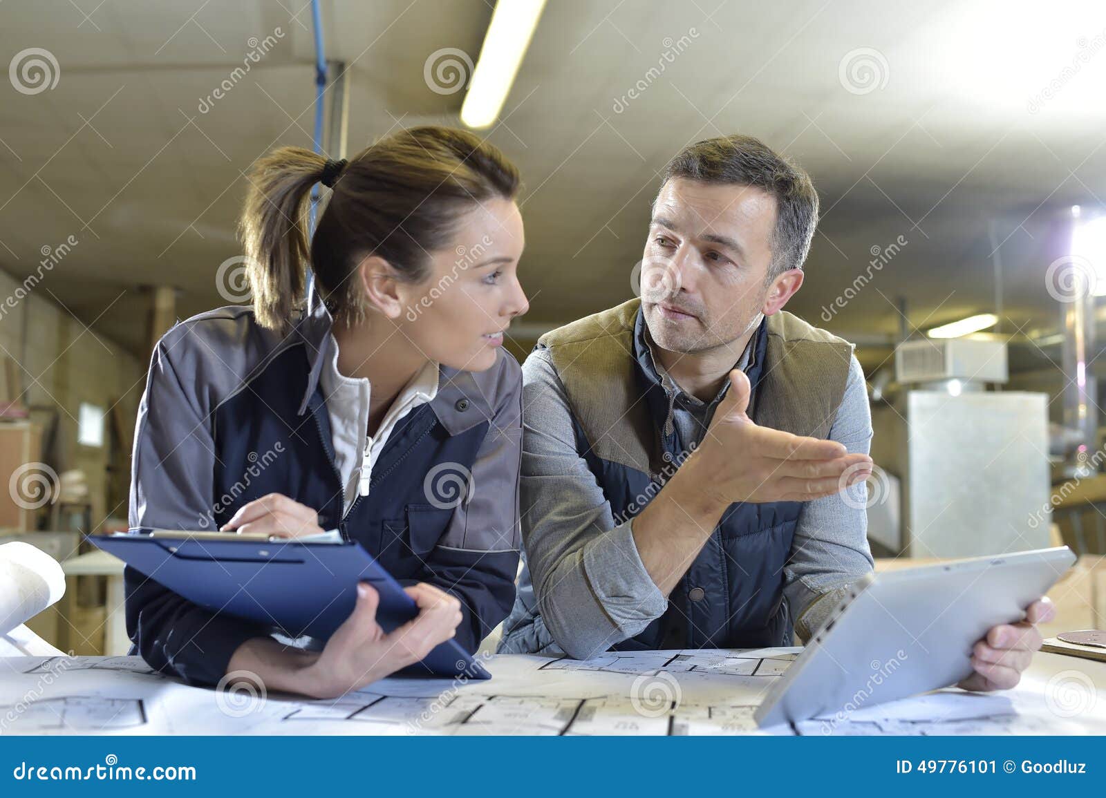 Woman and Carpentry Instructor Using Tablet Stock Image - Image of ...