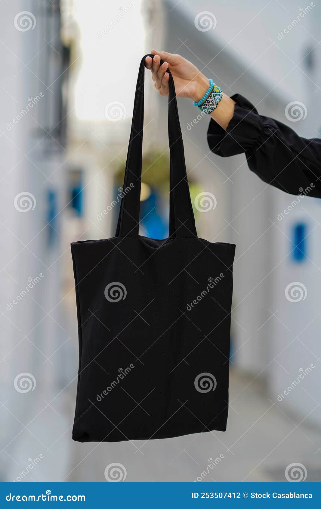 A Woman Carrying an Empty Black Canvas Bag. Stock Photo - Image of mock ...