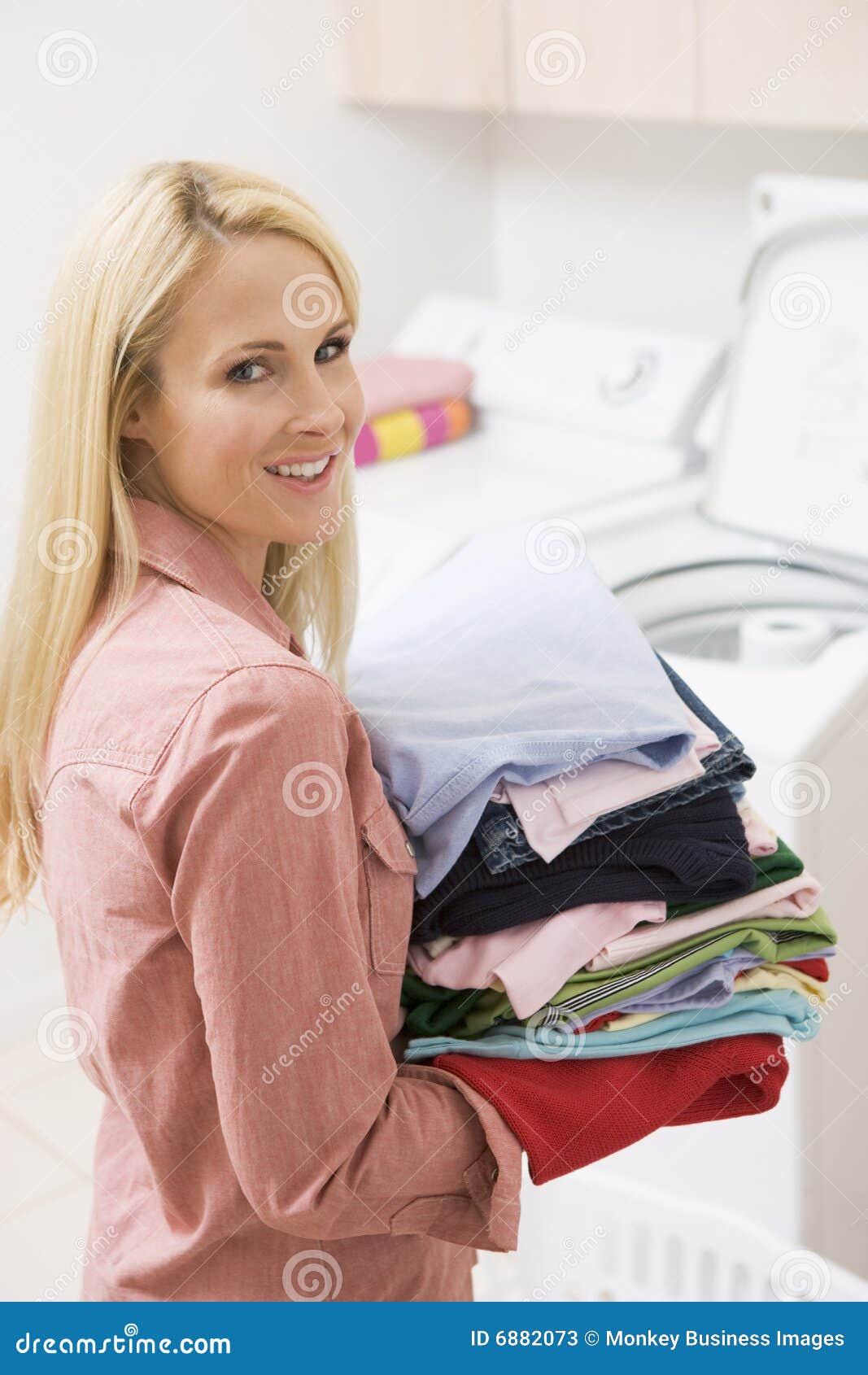 Woman Carrying Folded Up Laundry Stock Image - Image of domestic, home ...