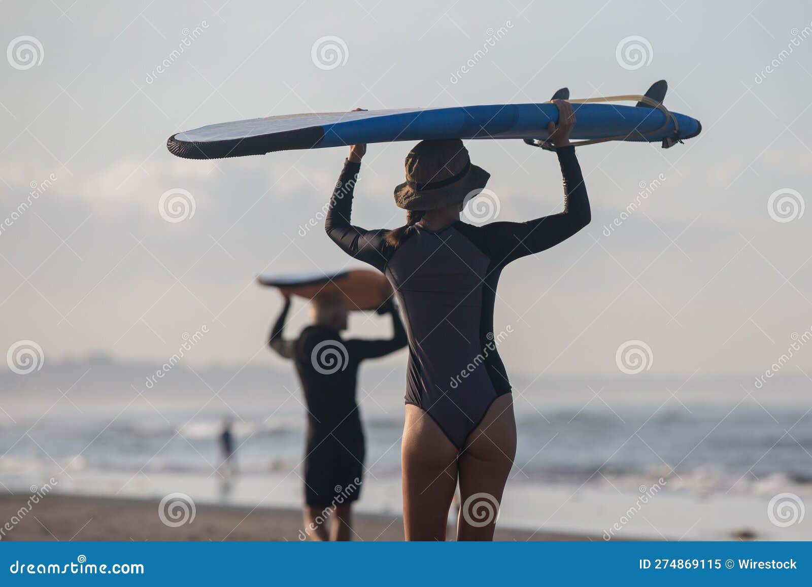 Woman Carrying A Surfboard On Her Head Stock Image Image Of Water