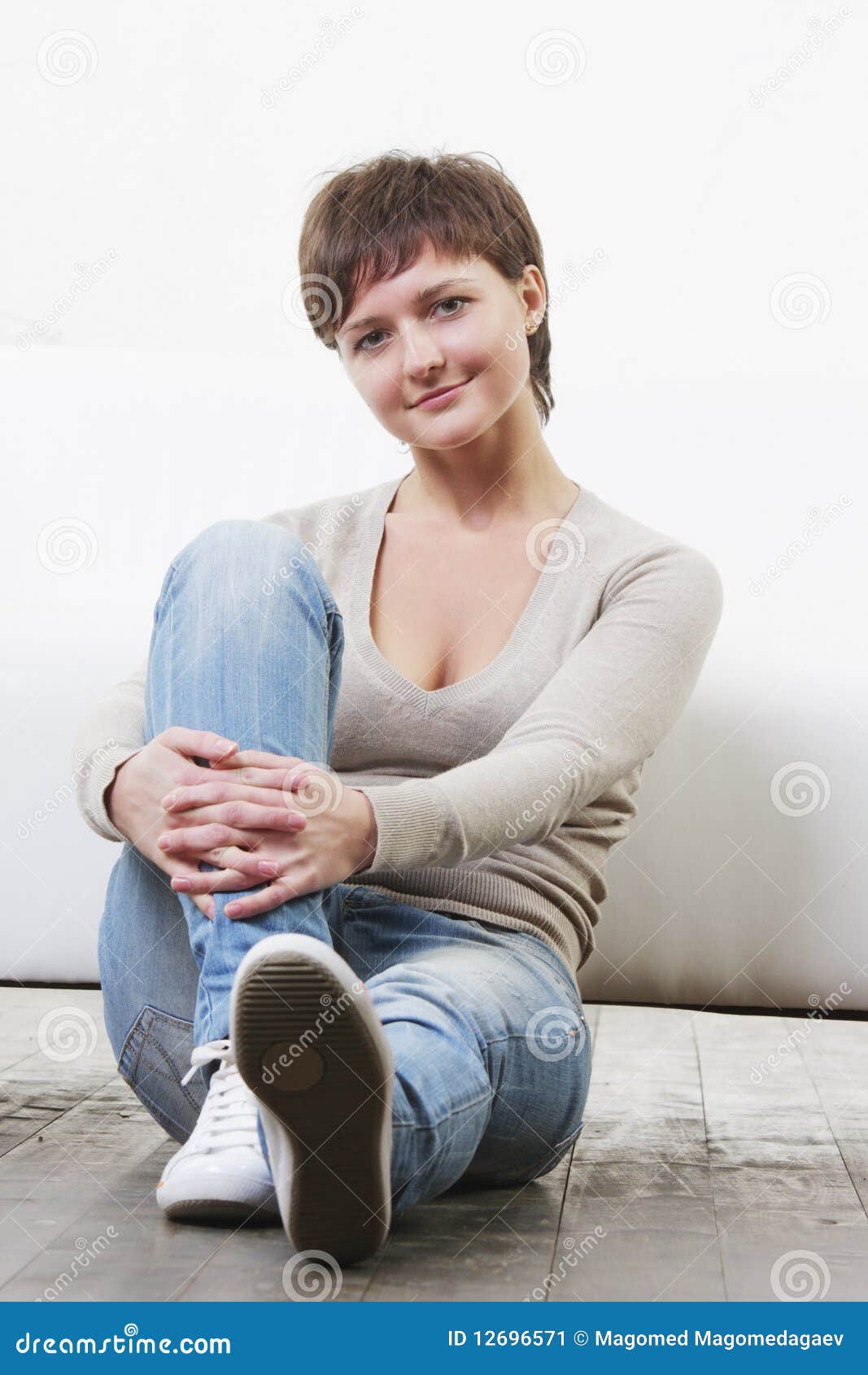 Casual Man Sitting Crouched And Smiling Stock Photo | CartoonDealer.com ...